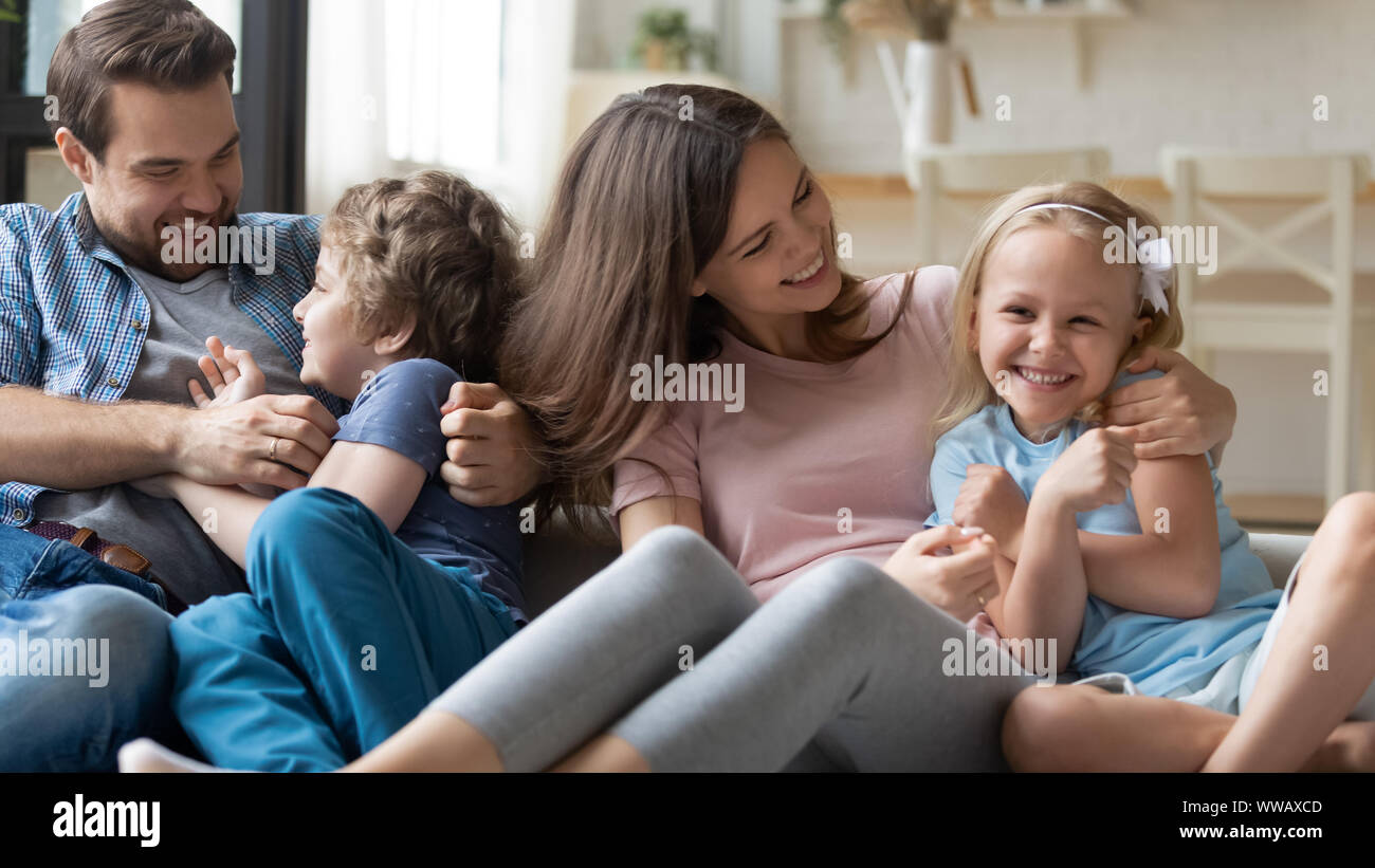 Joyful family playing together home hi-res stock photography and images ...