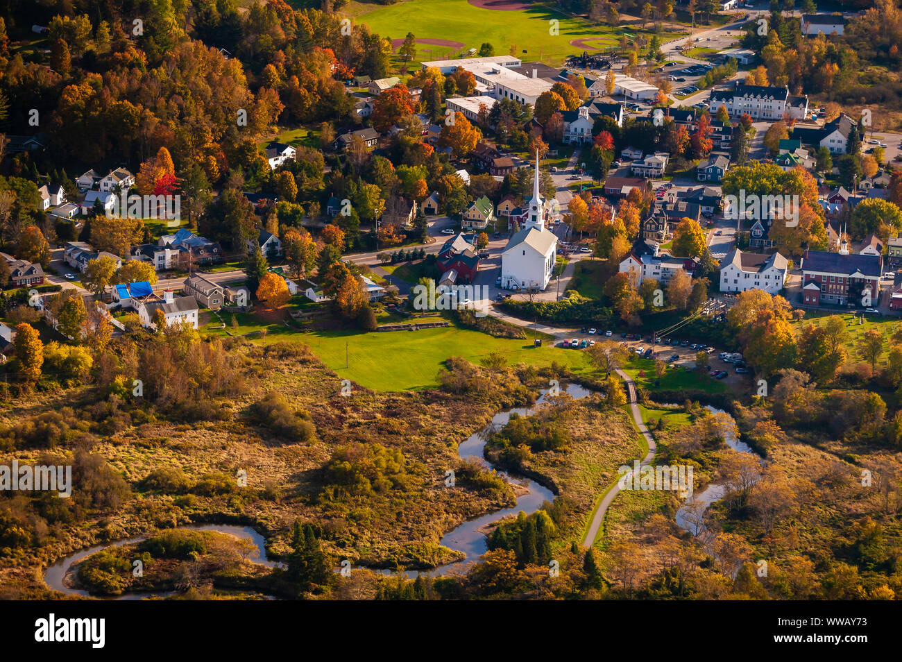 Aerial view of the town of Stowe Vermont on a colorful autumn afternoon ...