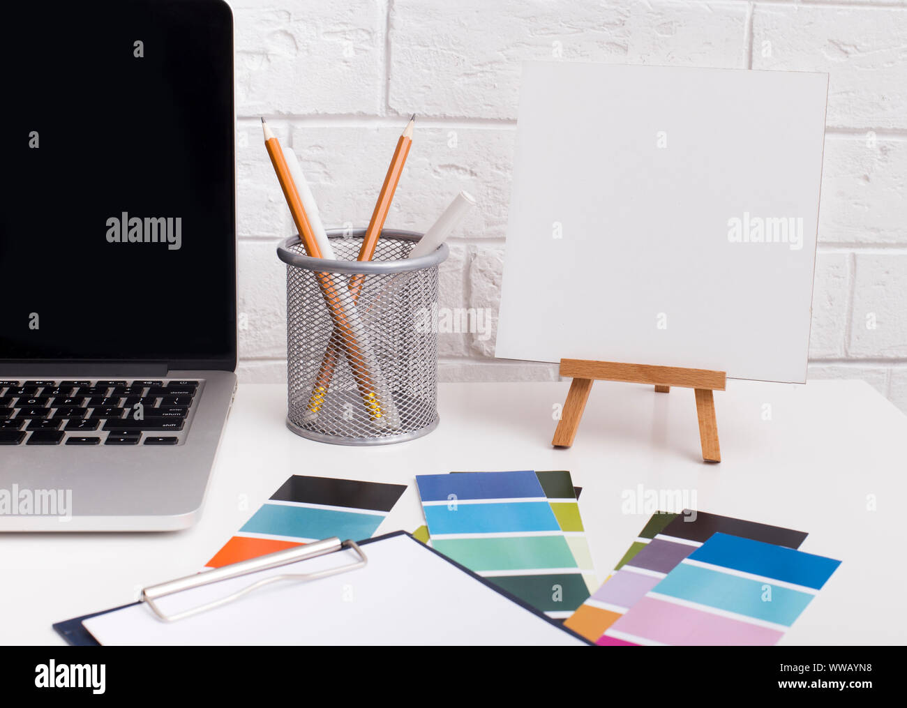 Close up of Designer workplace with color palette on office table Stock ...