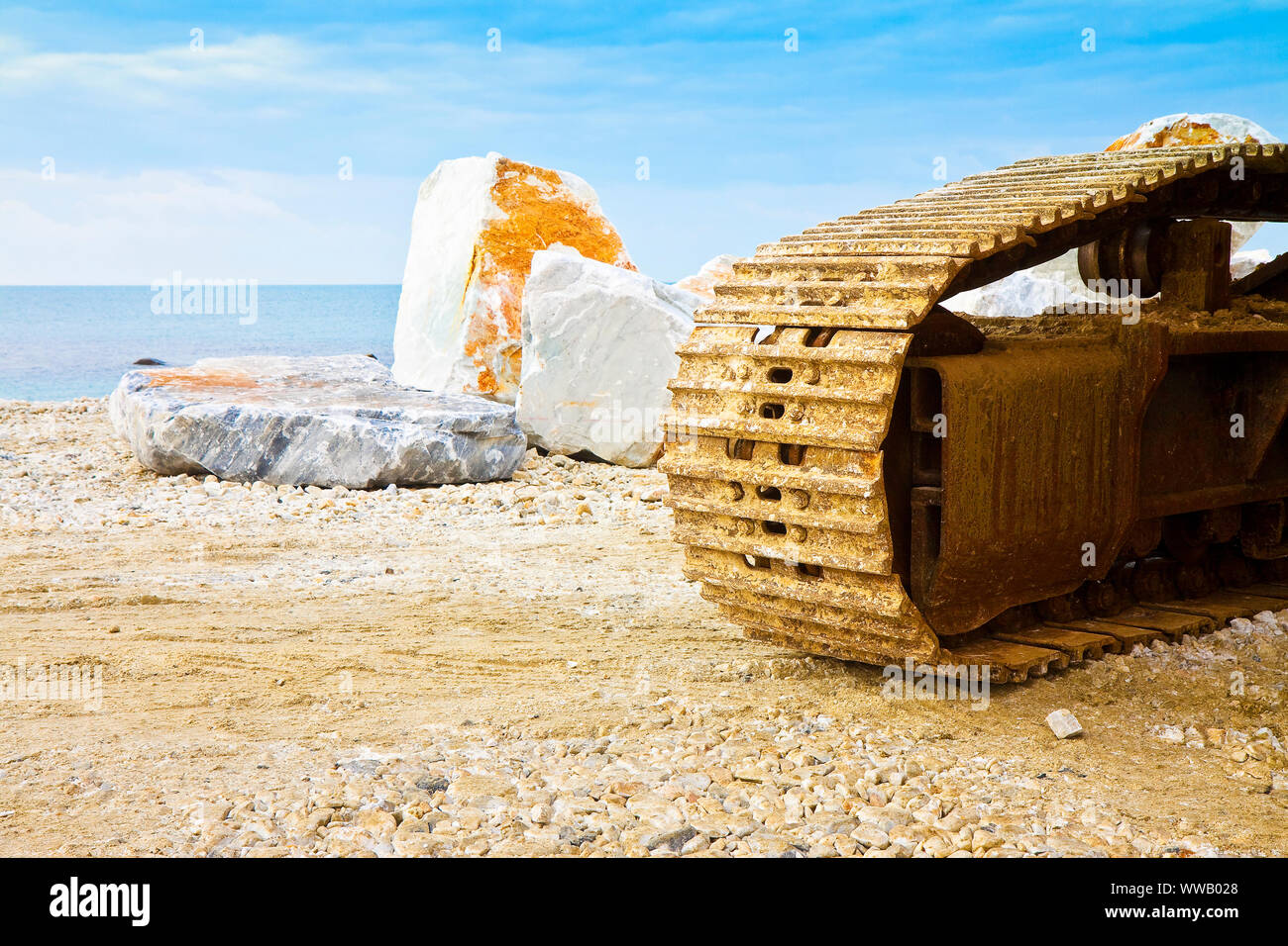Detail of the track of a digging machine and moving earth at ...