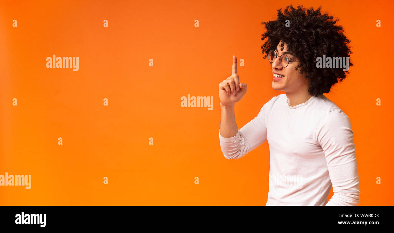 Handsome guy pointing finger up hi-res stock photography and images - Alamy