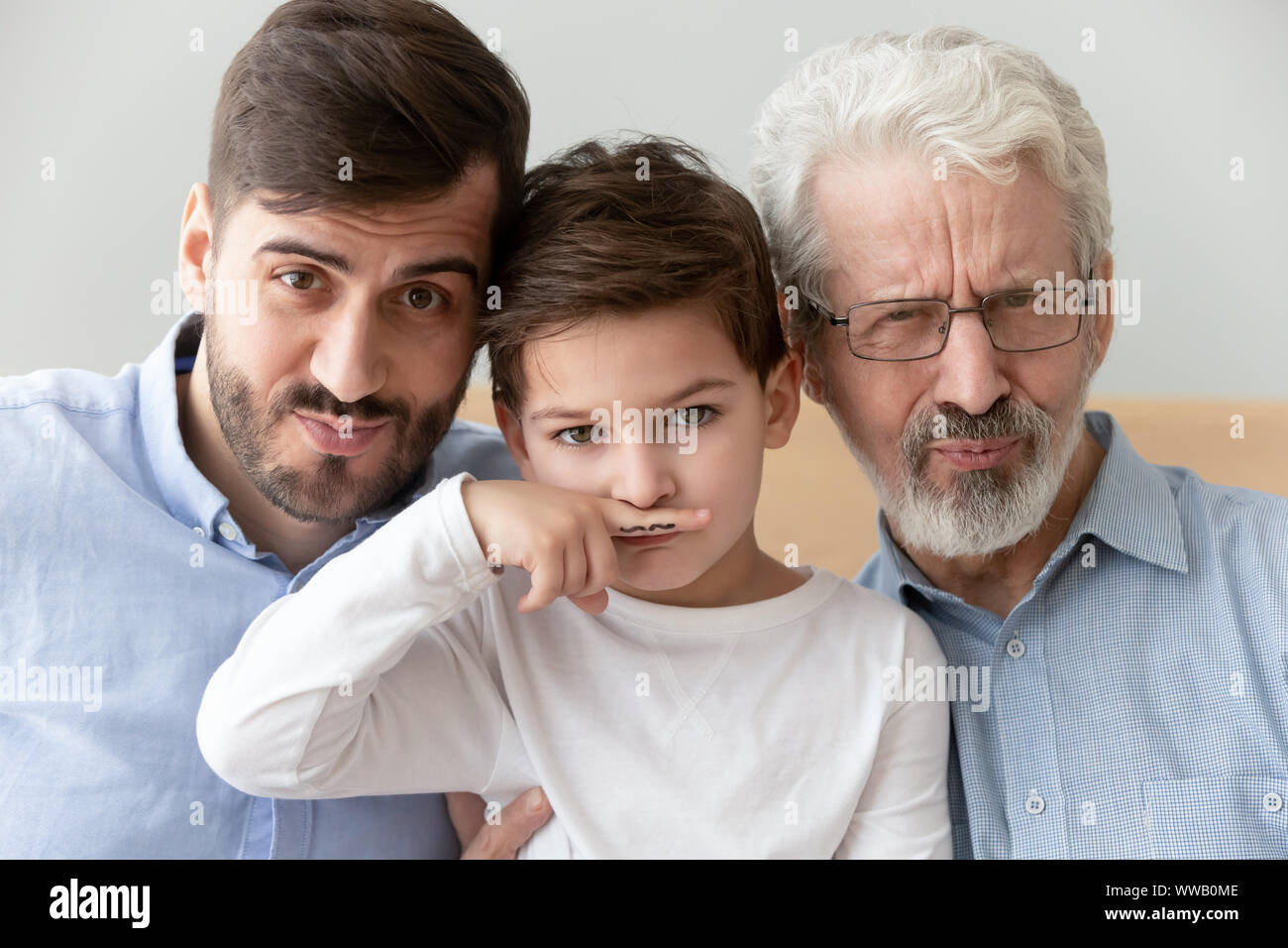 Happy funny three generation men family close up portrait Stock Photo ...