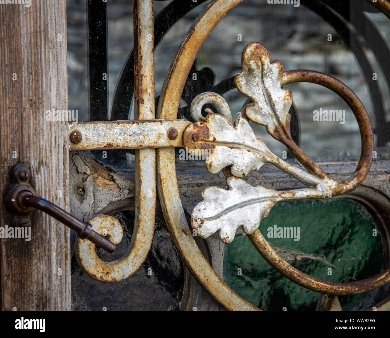 door handle decorated with wrought iron flowers Stock Photo - Alamy