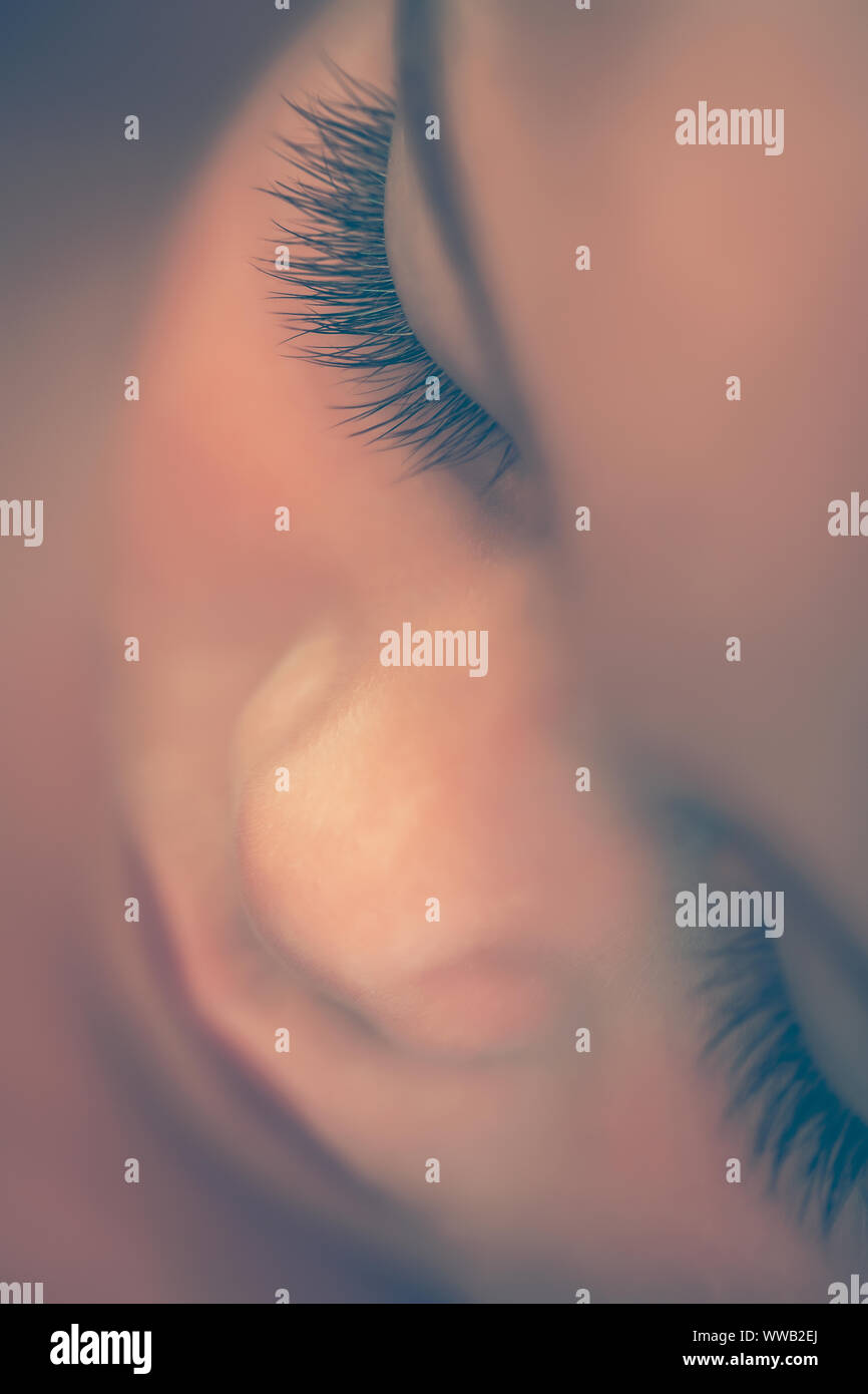 Closeup portrait of a nice sleeping baby boy with a beautiful long ...