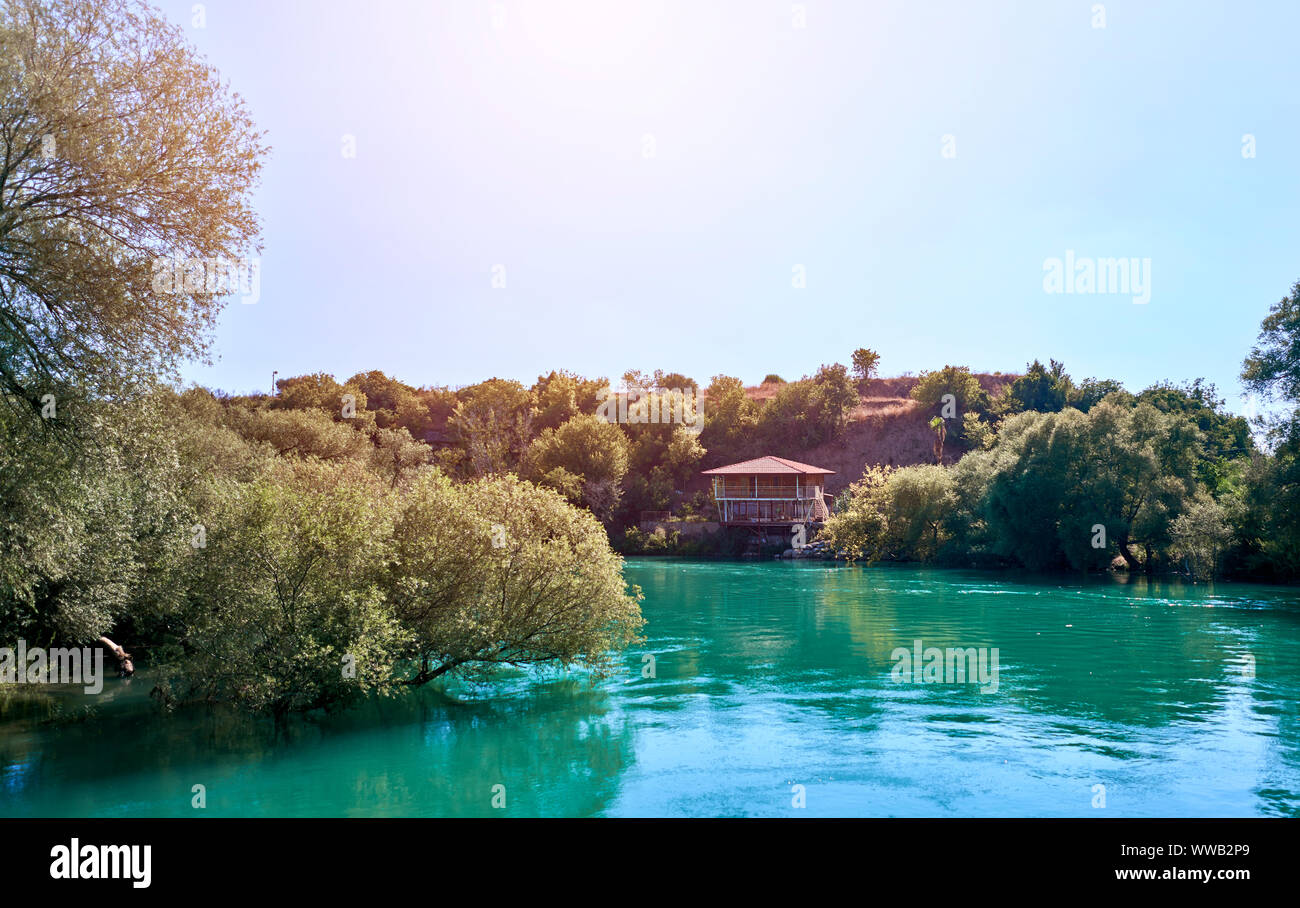view of a large river with a waterfall Stock Photo - Alamy