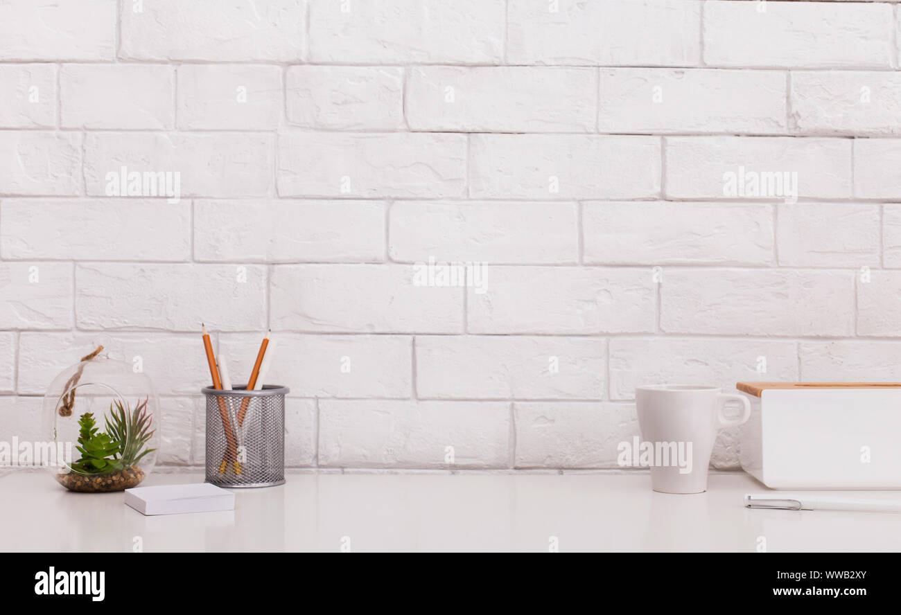 Design of stylish office table in modern office over white wall Stock ...