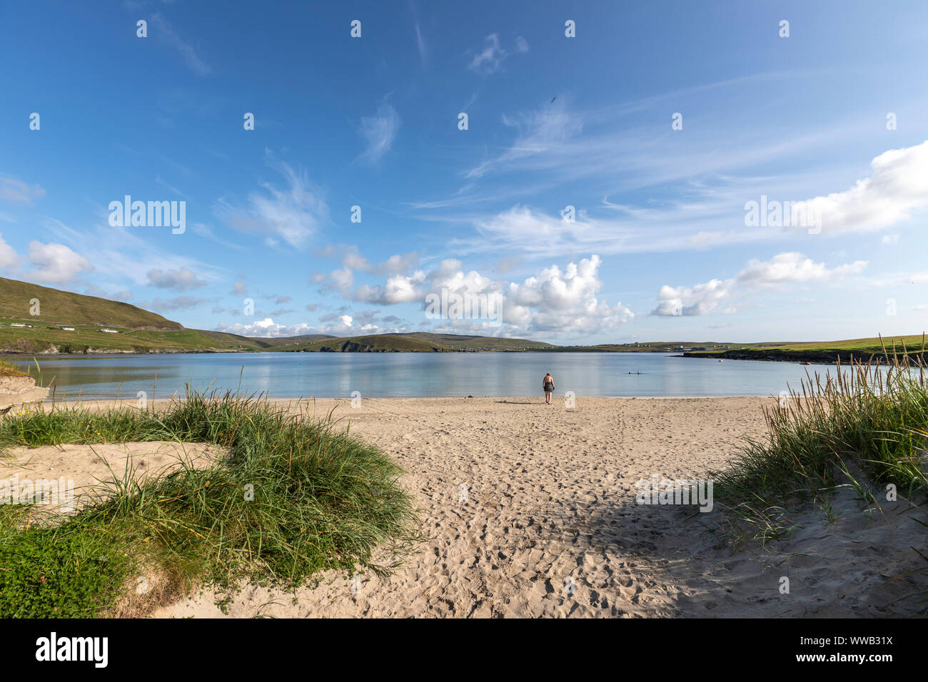 Woman entering in the sea in Levenwick Beach, Mainland, Shetland ...