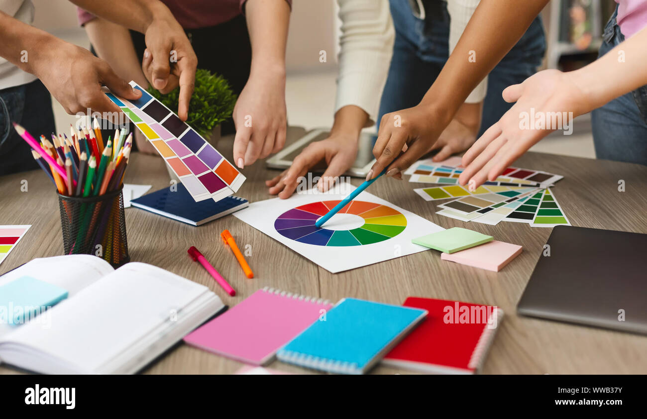 Group of young graphic designers choosing color swatch samples Stock ...