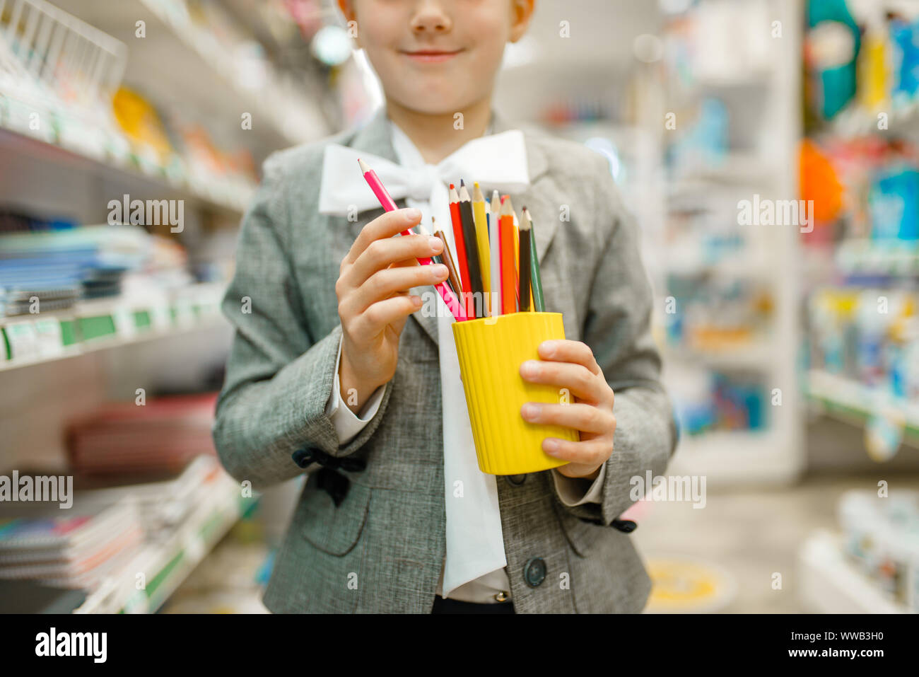 Schoolgirl with colorful pencils, stationery store Stock Photo - Alamy
