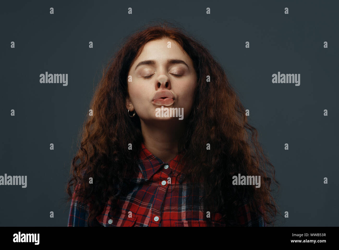 Woman's crazy face crushed on transparent glass Stock Photo - Alamy