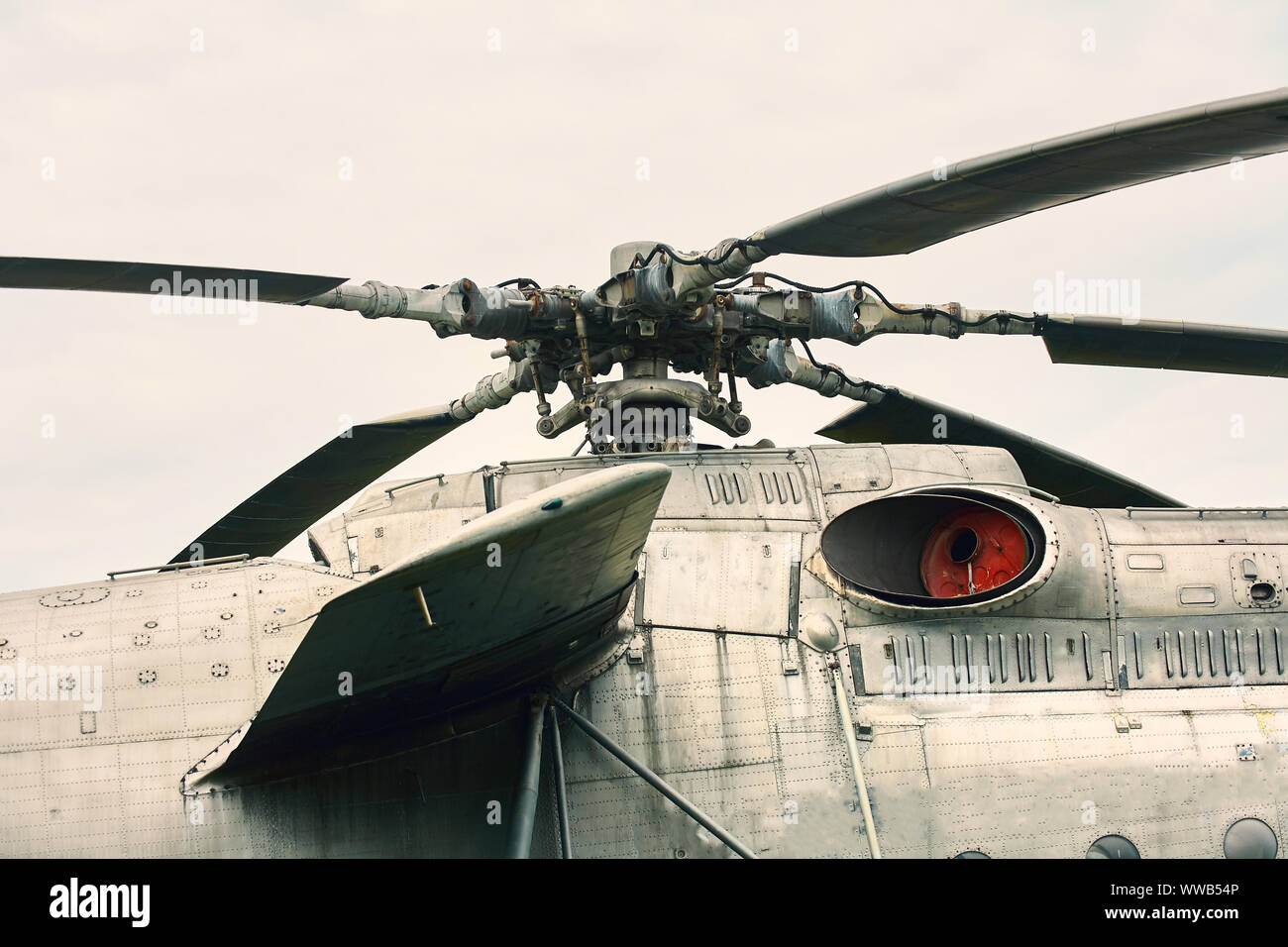 The propeller of the helicopter close-up against a gray sky. Color ...