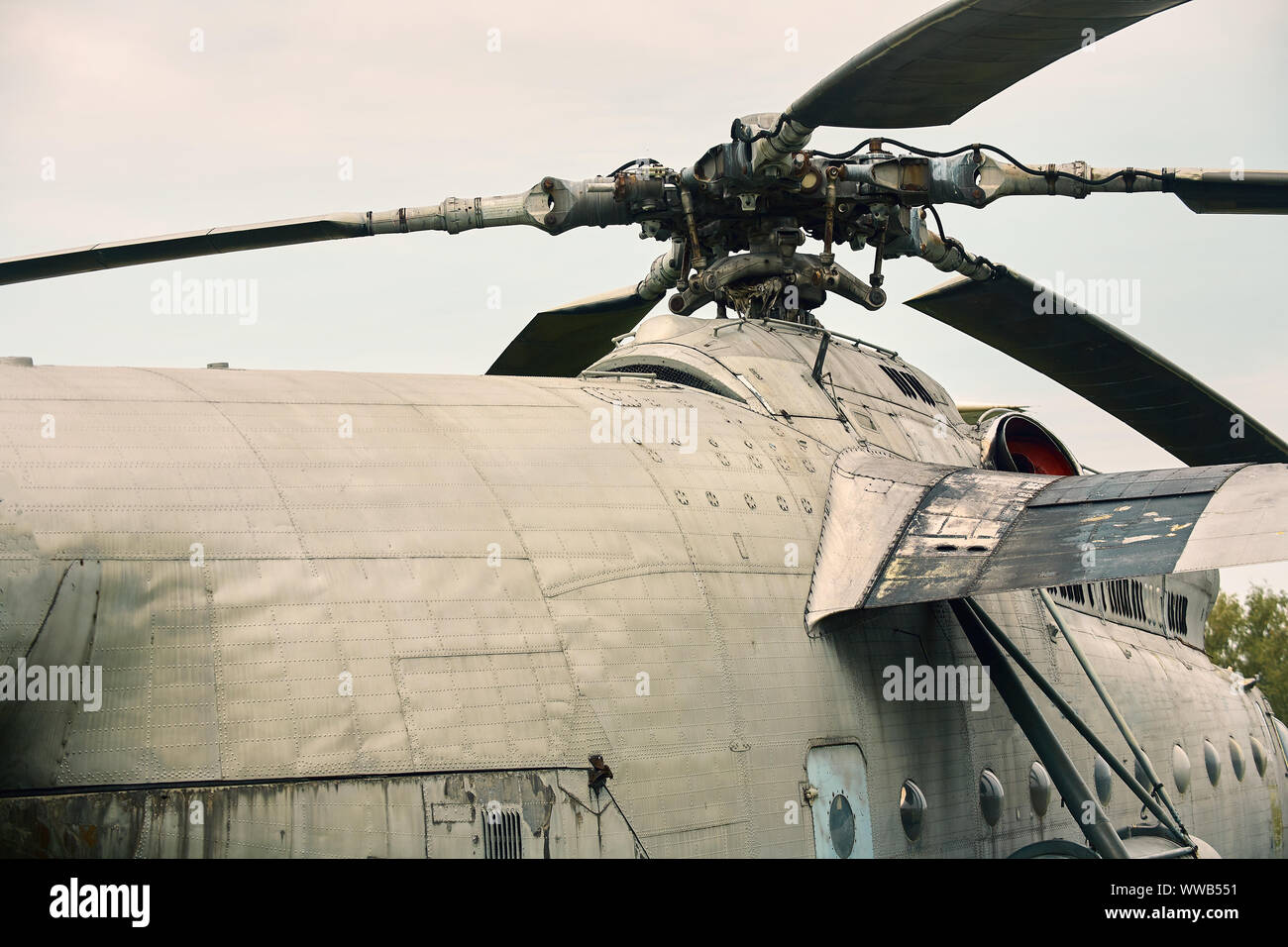 The propeller of the helicopter close-up against a gray sky. Color ...