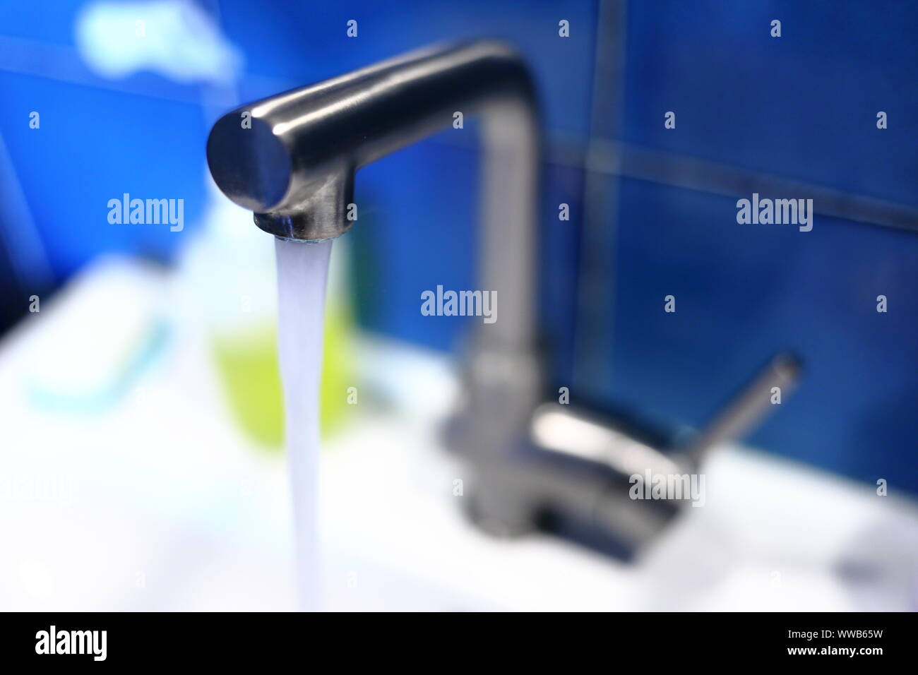 Washbasin tap with stainless steel waste Stock Photo - Alamy
