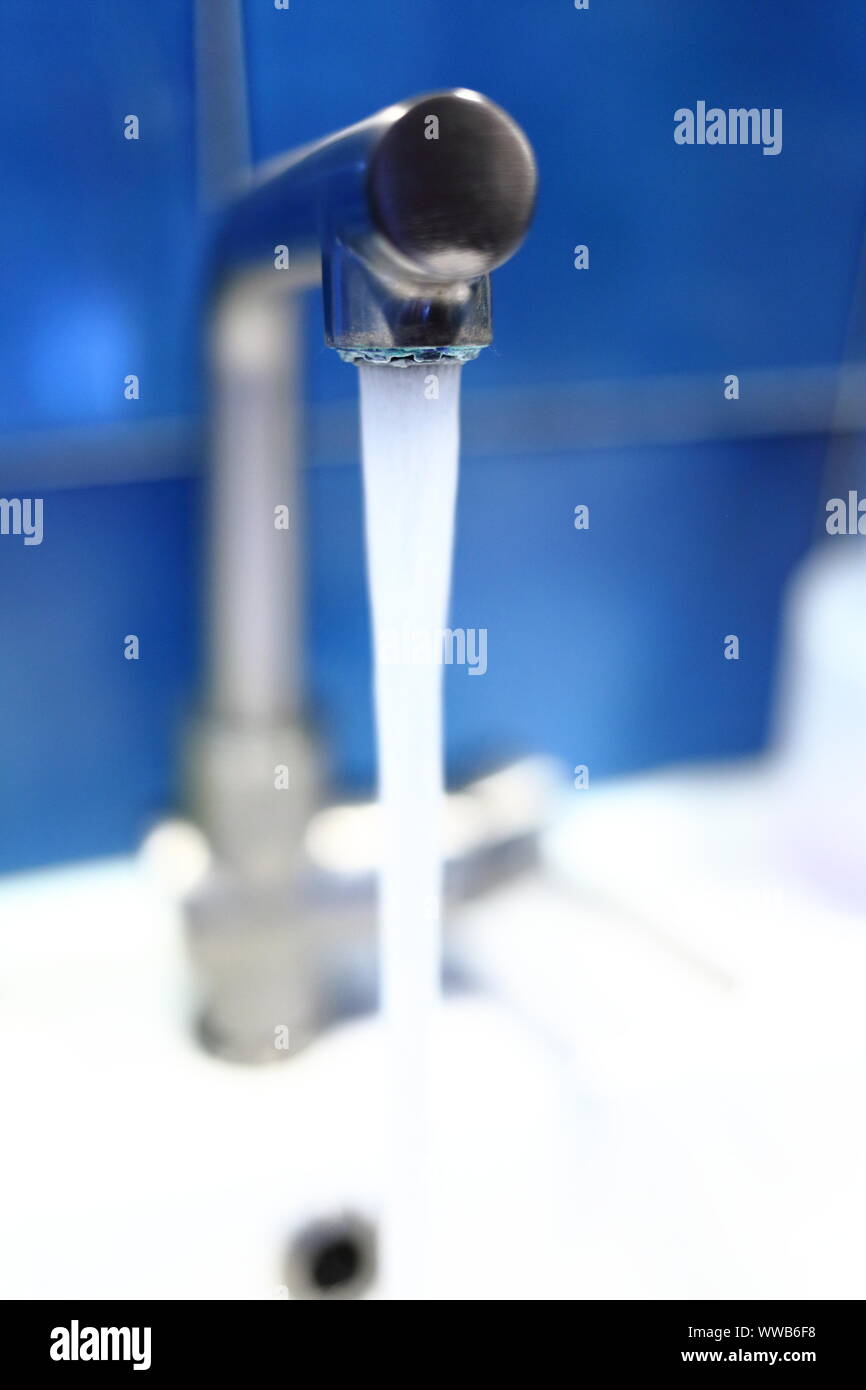 Washbasin tap with stainless steel waste Stock Photo - Alamy