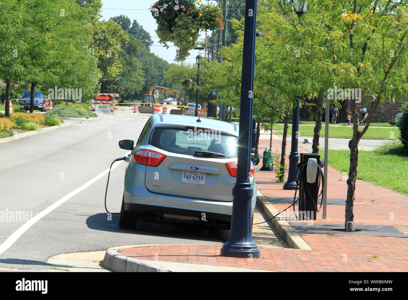 A Ford C-Max Energi electric vehicle recharging at an EV station in ...