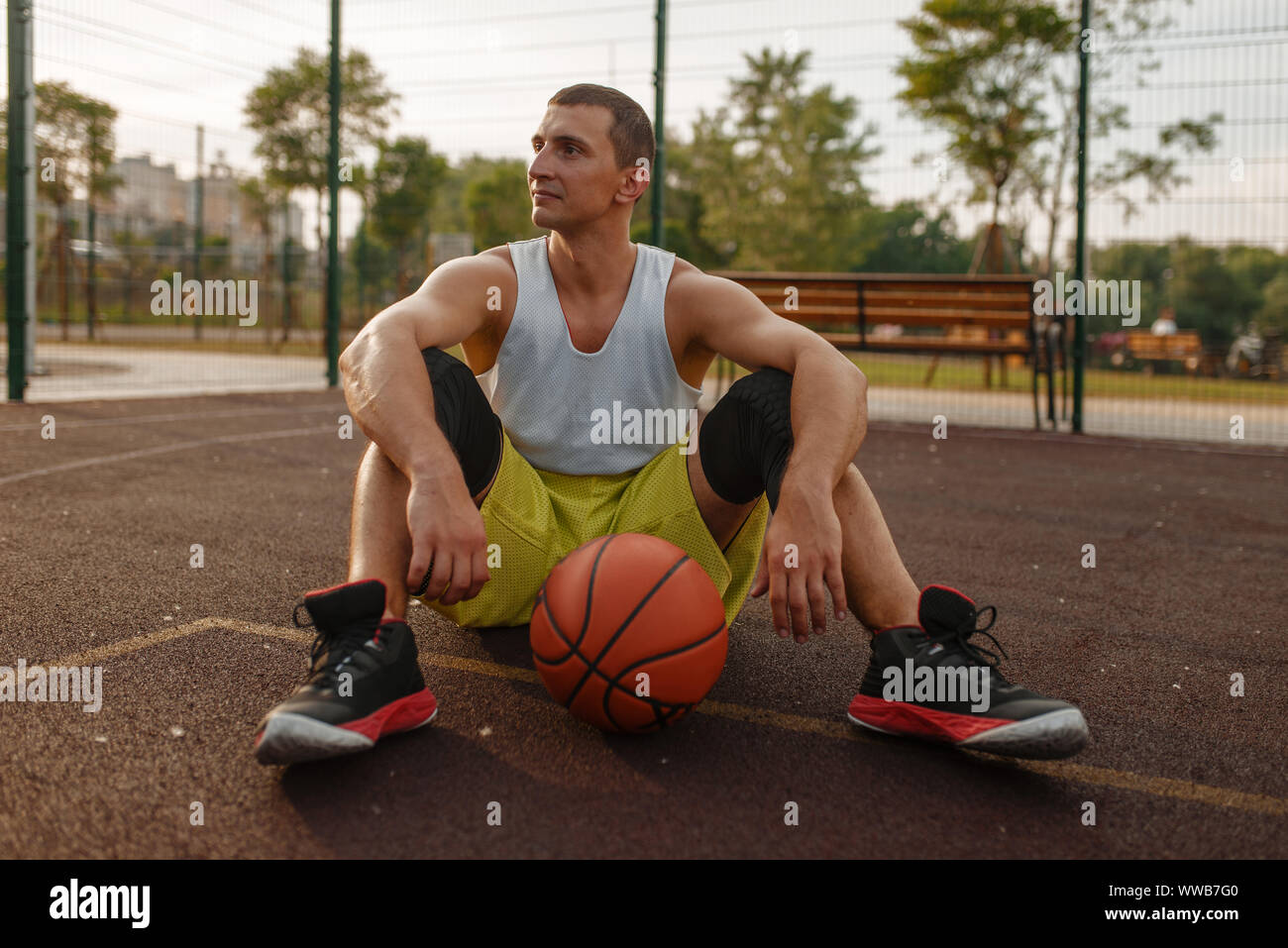 Guy sitting on ball playing hi-res stock photography and images - Alamy