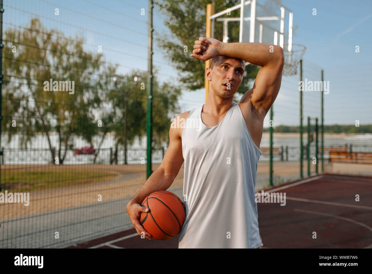 Tired man playing basketball hi-res stock photography and images - Alamy