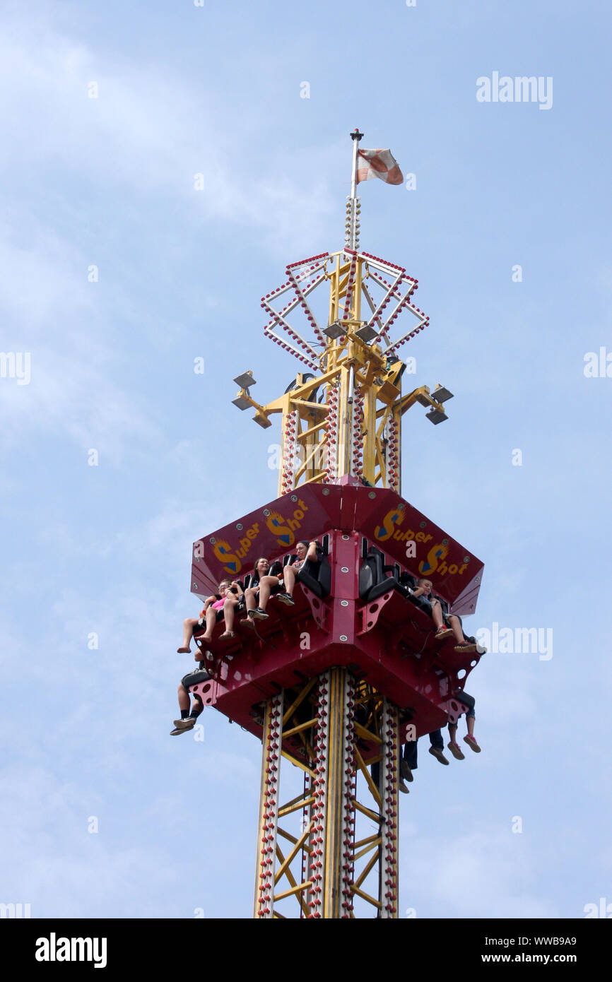 The drop tower ride at carnival Stock Photo - Alamy