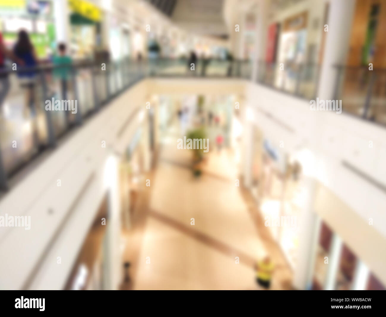 Blurred shopping mall white bright interior background. Defocused trade ...