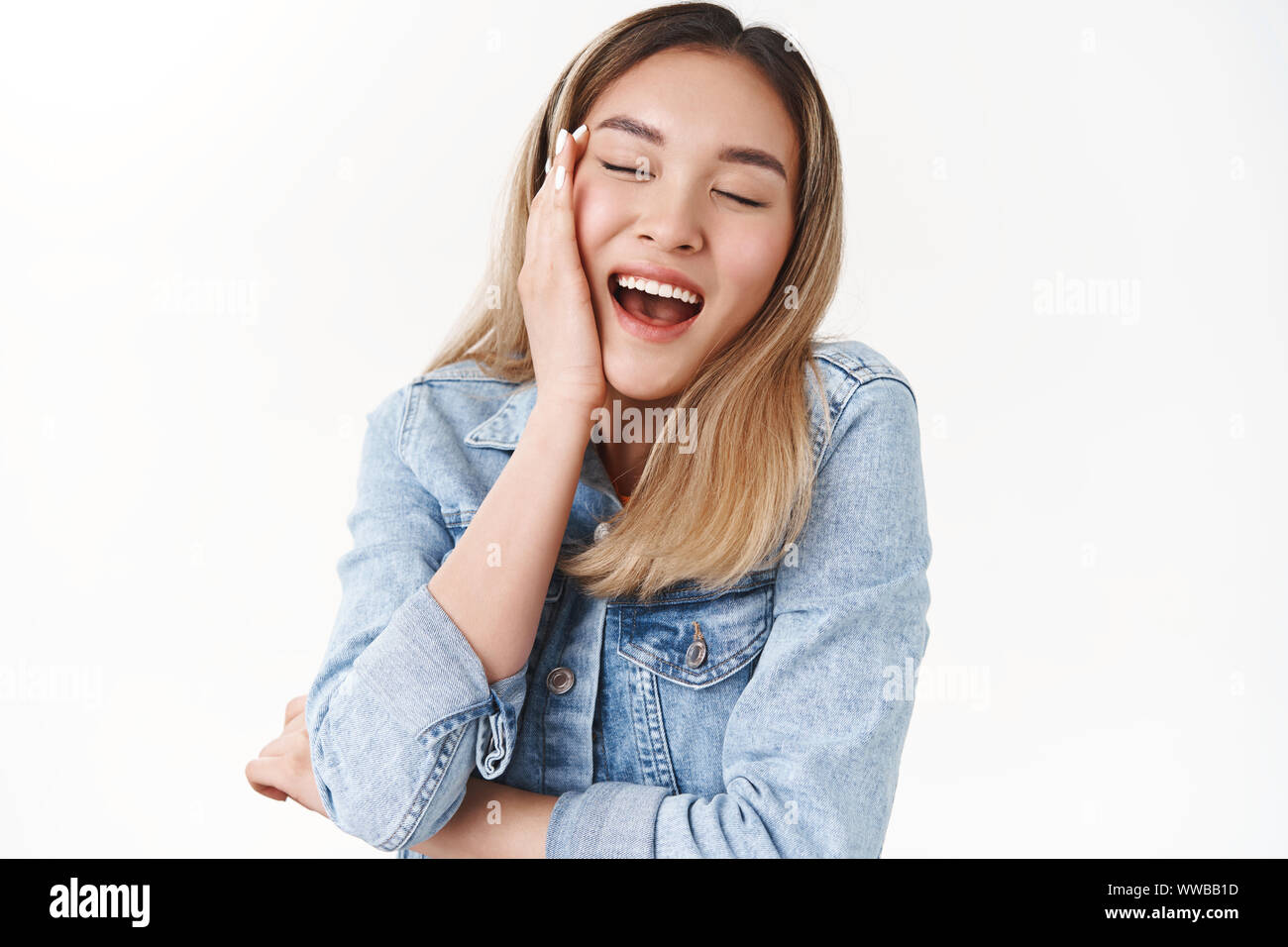 Cheerful feminine cute silly asian blond girlfriend feel happiness joy ...