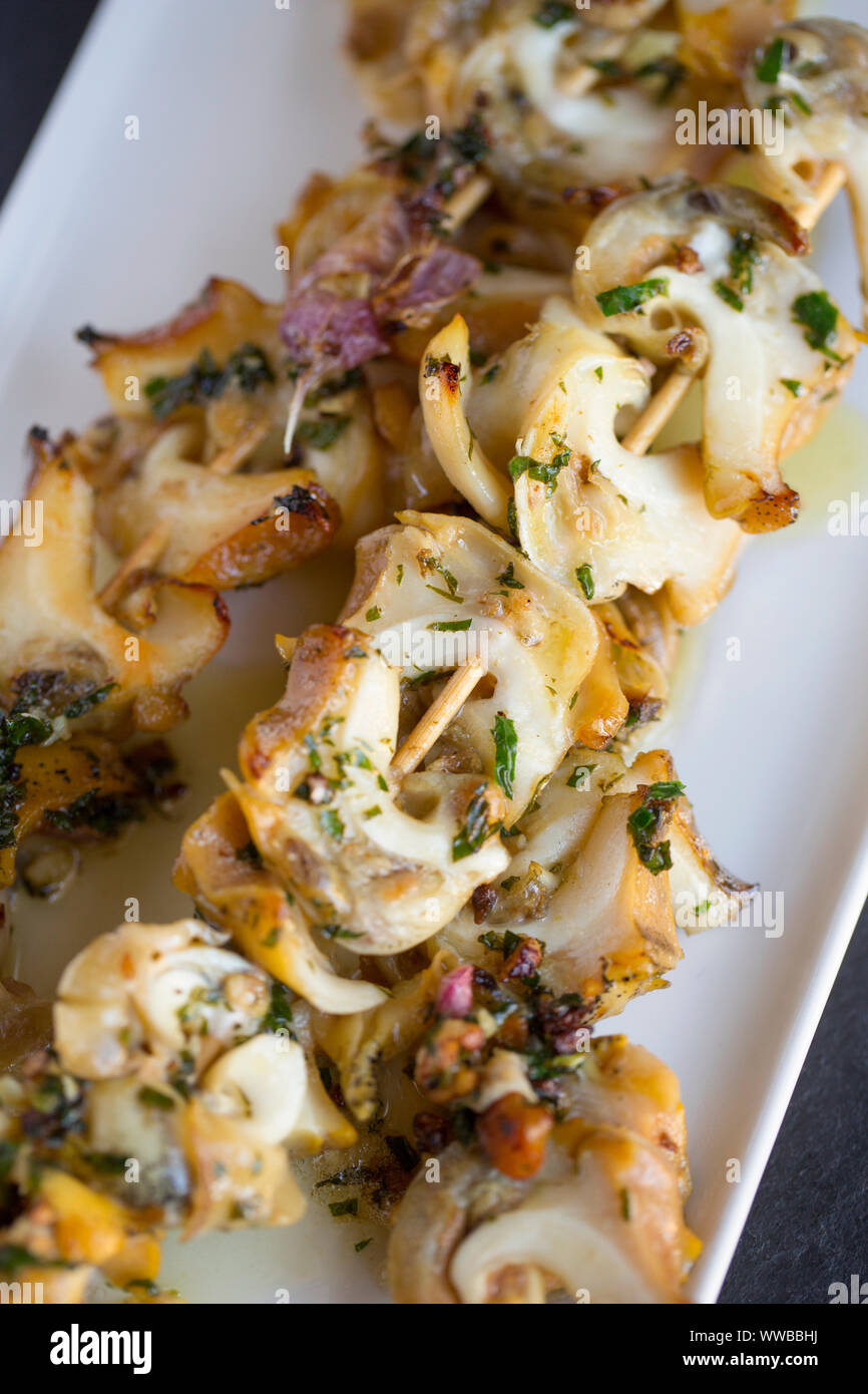 Whelks, Buccinum undatum, that have first been boiled and then cut in ...