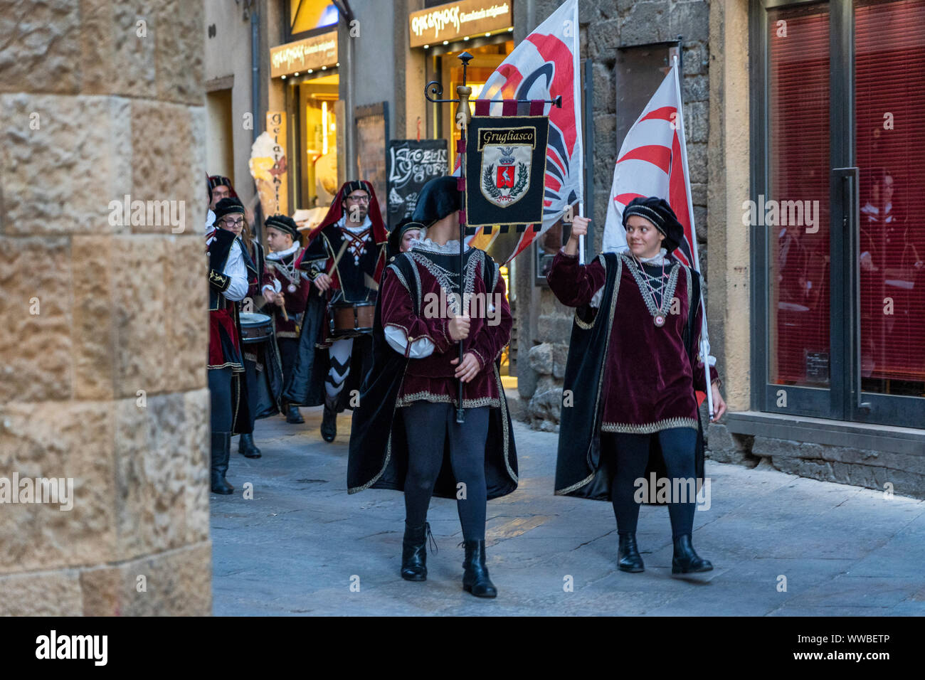 Volterra, Pisa, Tuscany, Italy: medieval procession with flags and ...