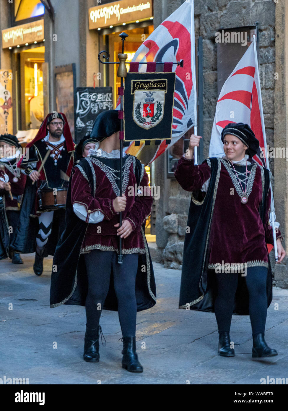 Volterra, Pisa, Tuscany, Italy: medieval procession with flags and ...