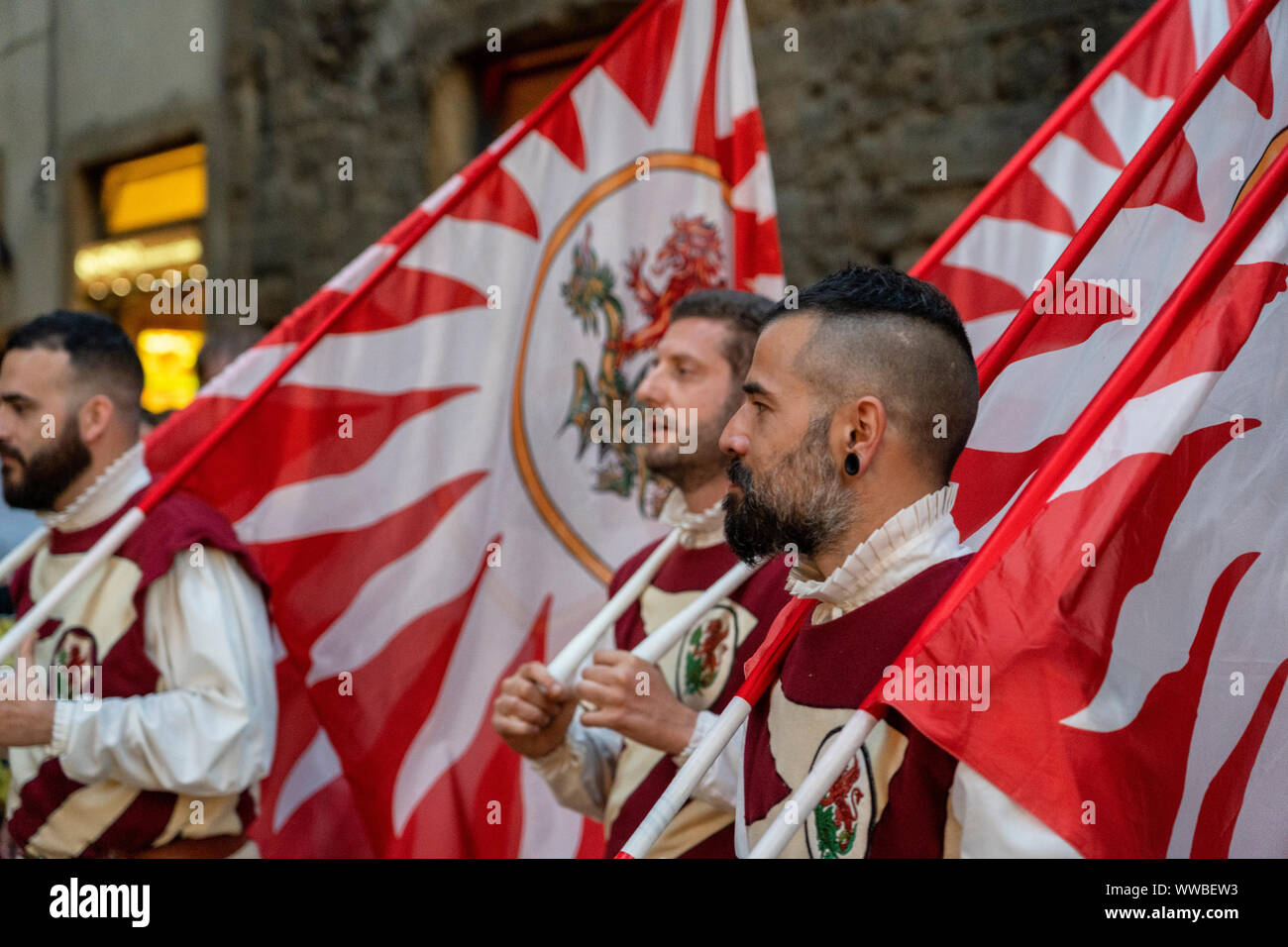 Volterra, Pisa, Tuscany, Italy: medieval procession with flags and ...