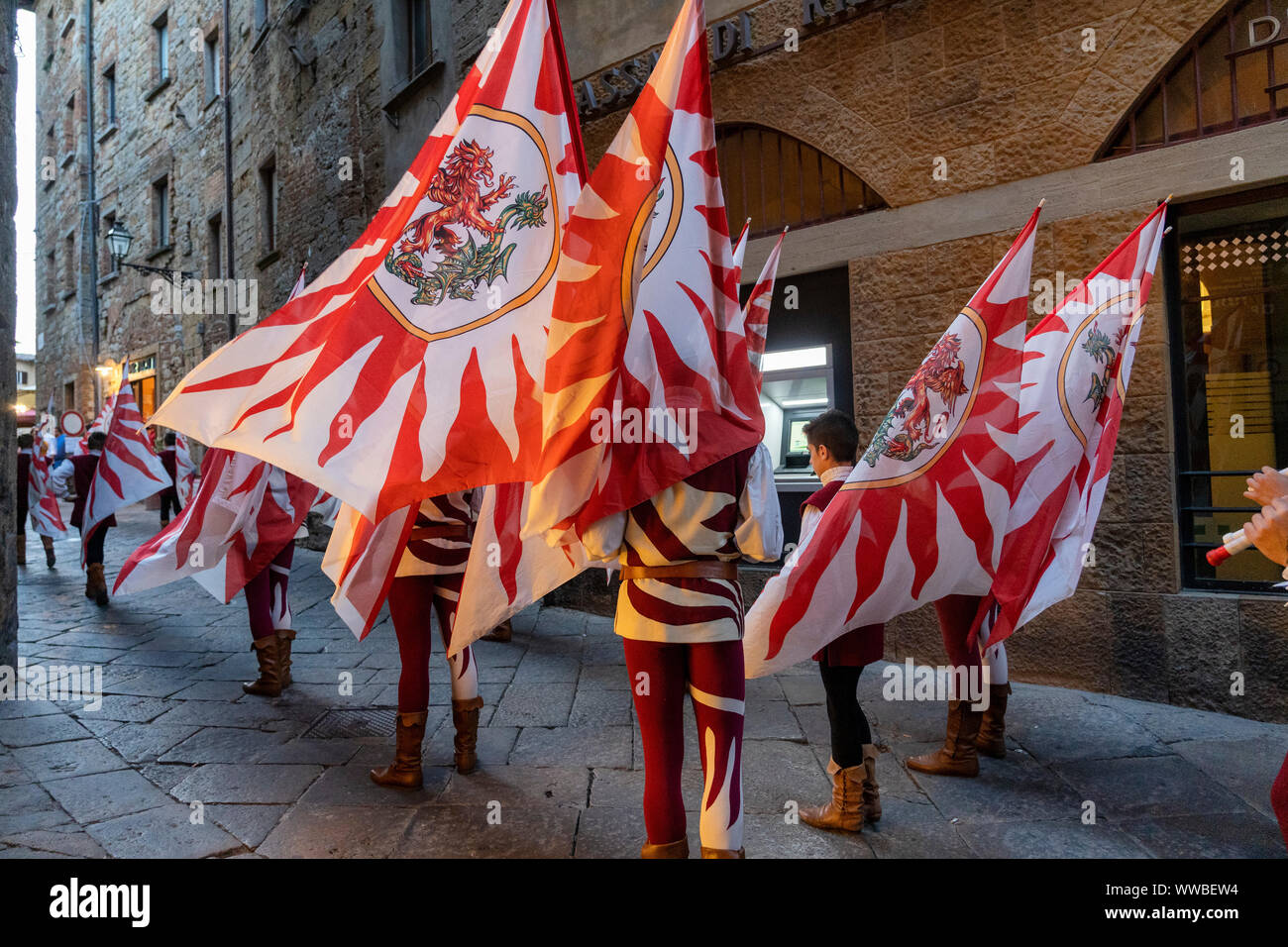 Volterra, Pisa, Tuscany, Italy: medieval procession with flags and ...