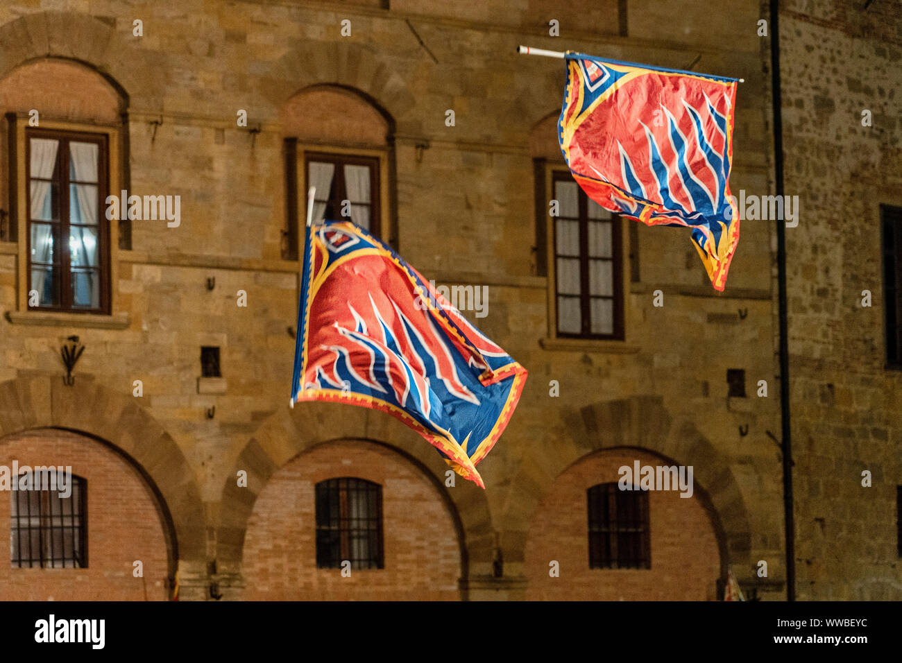 Volterra, Pisa, Tuscany, Italy: medieval feast with flags and ...
