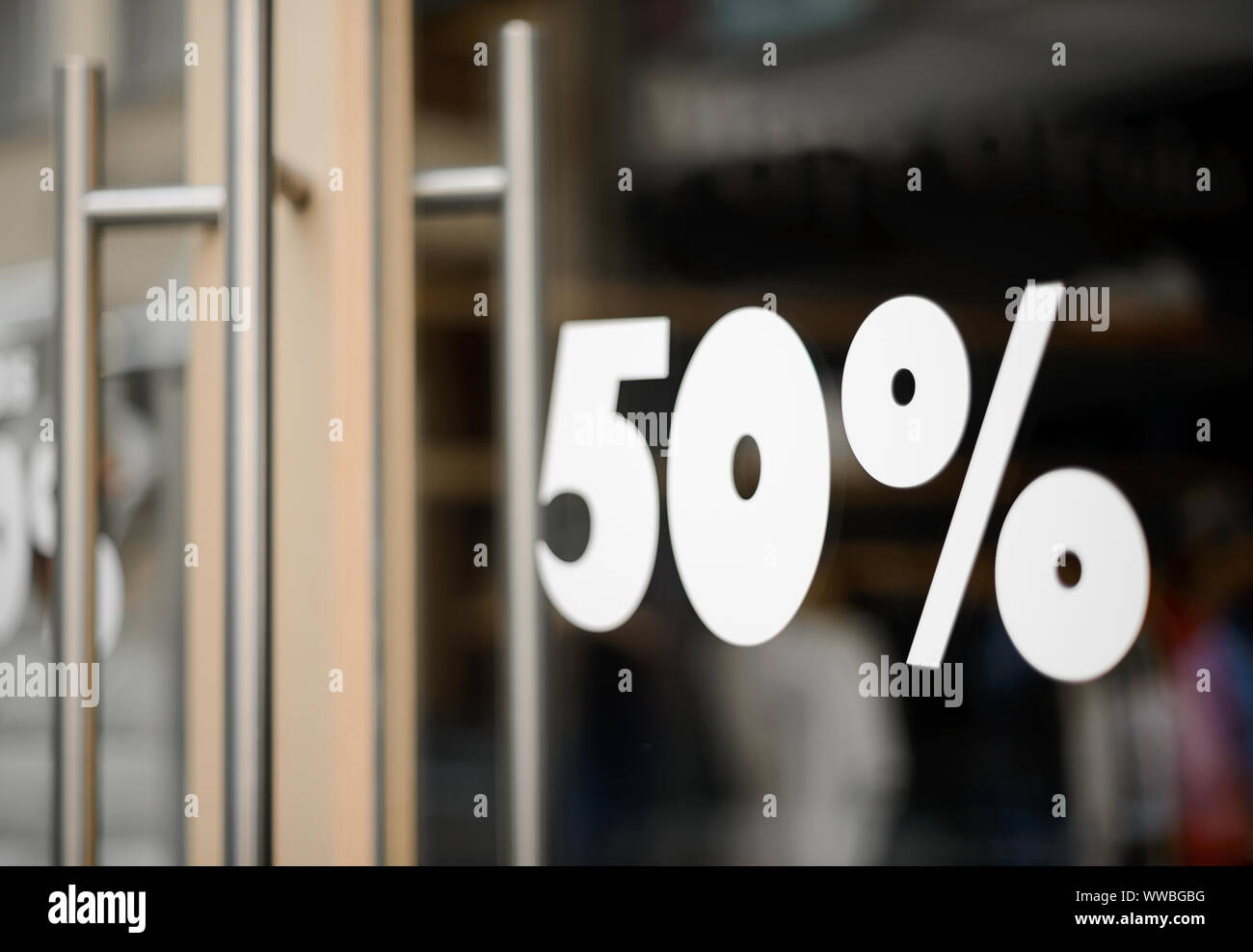 Store window display sale 50 percent rebate discount retail offer in ...