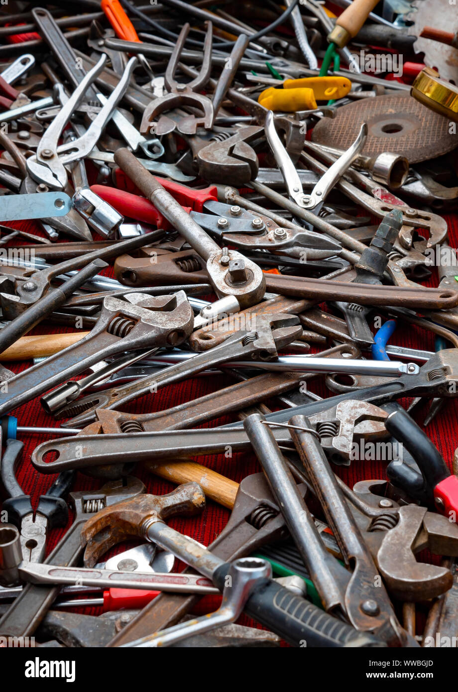 Table from a flea market covered with old tools Stock Photo - Alamy
