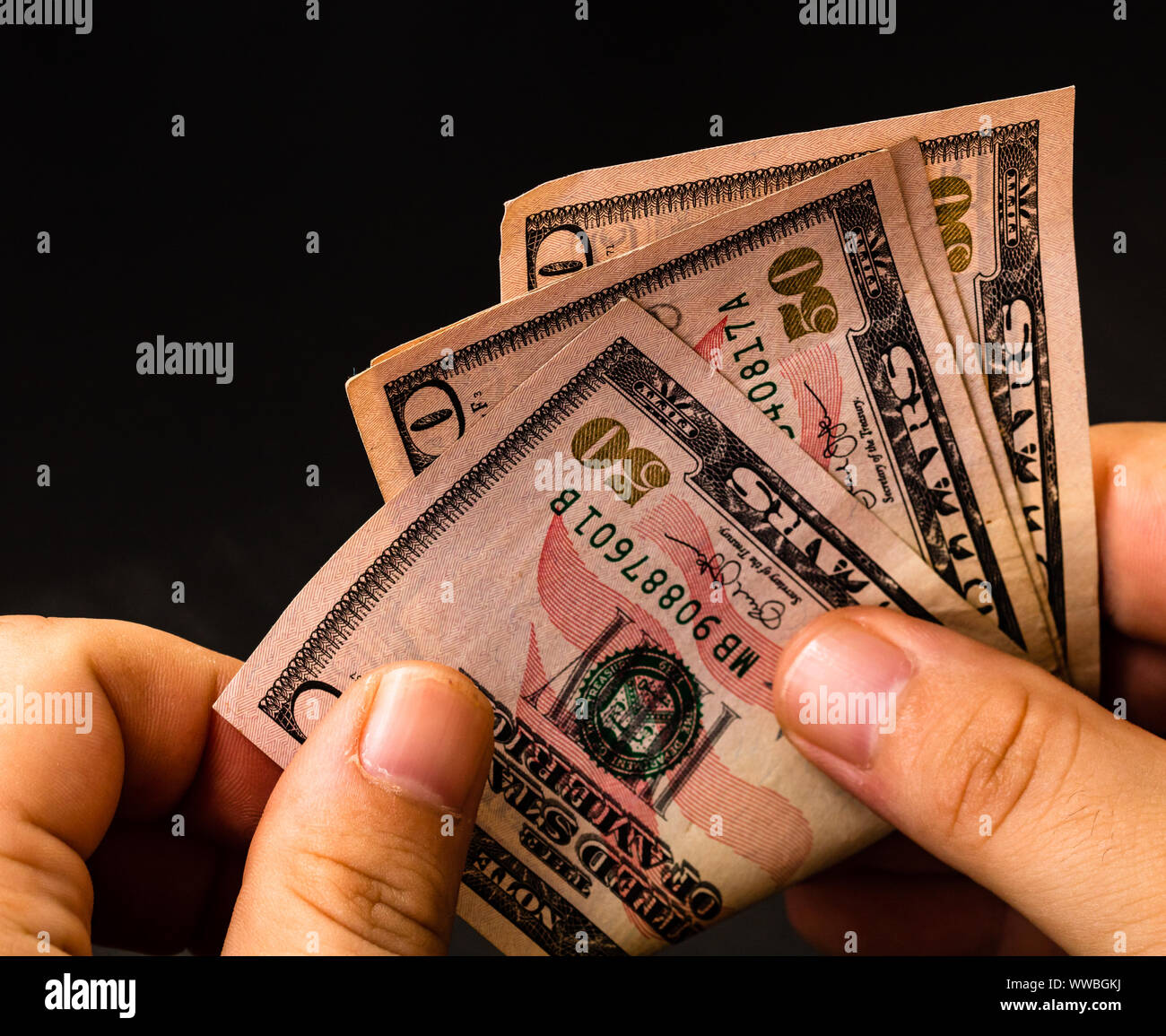Man counting money, counting dollars close up Stock Photo - Alamy