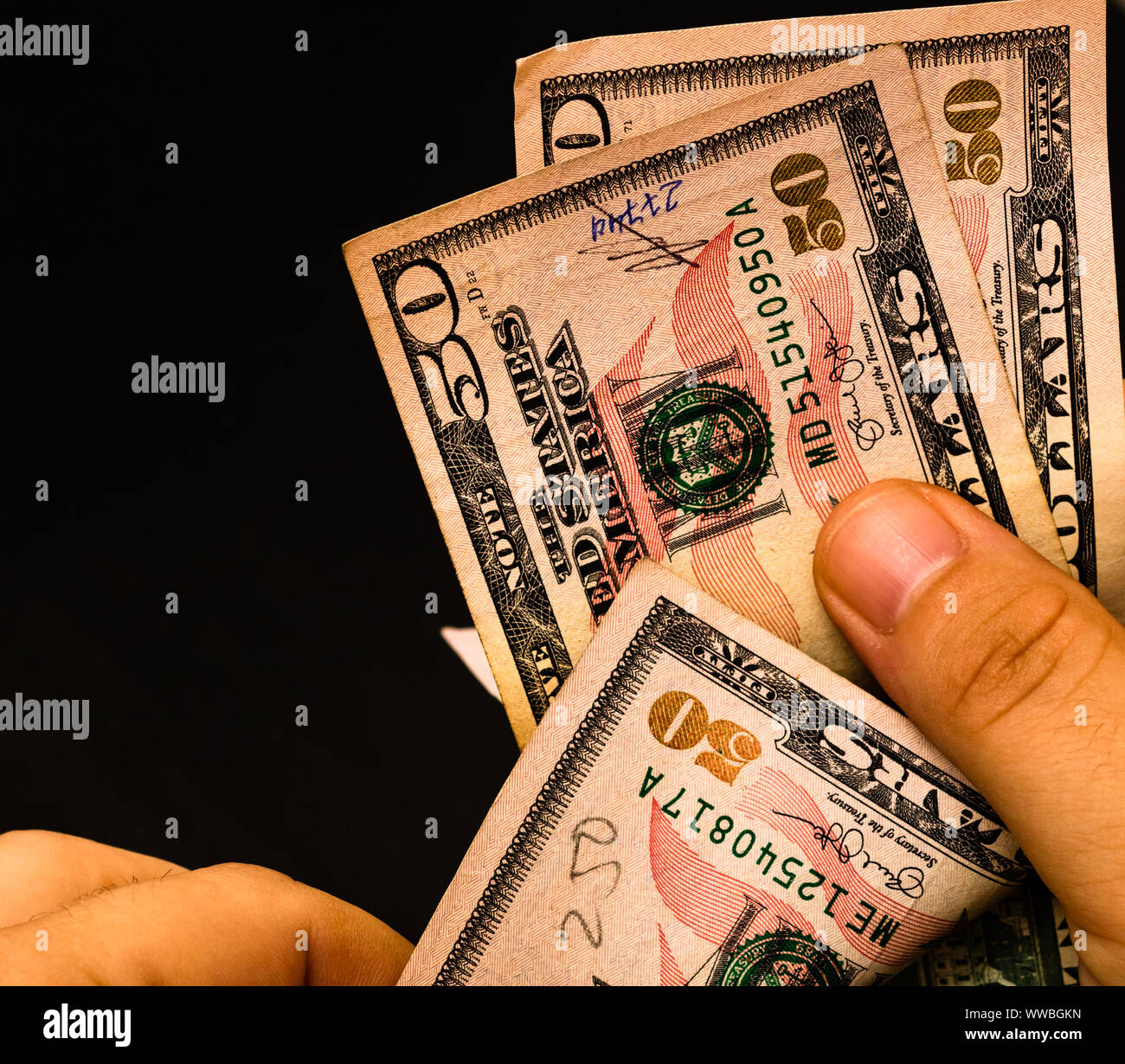 Man counting money, counting dollars close up Stock Photo - Alamy