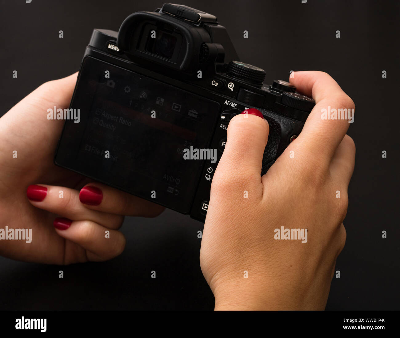 Female hand using photo camera. Close up woman hand on photo camera on ...