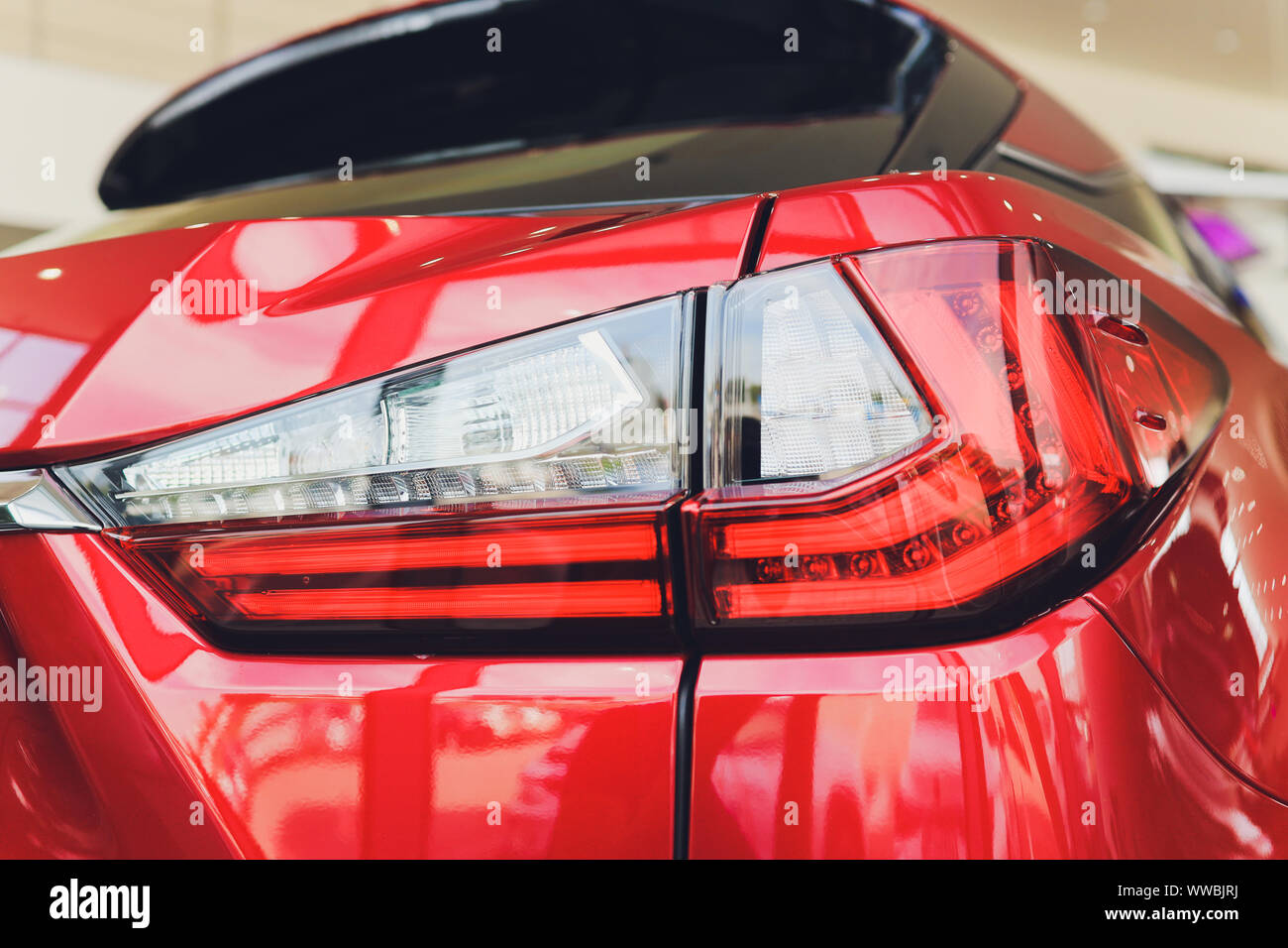 Detail on the rear light of a red car Stock Photo - Alamy