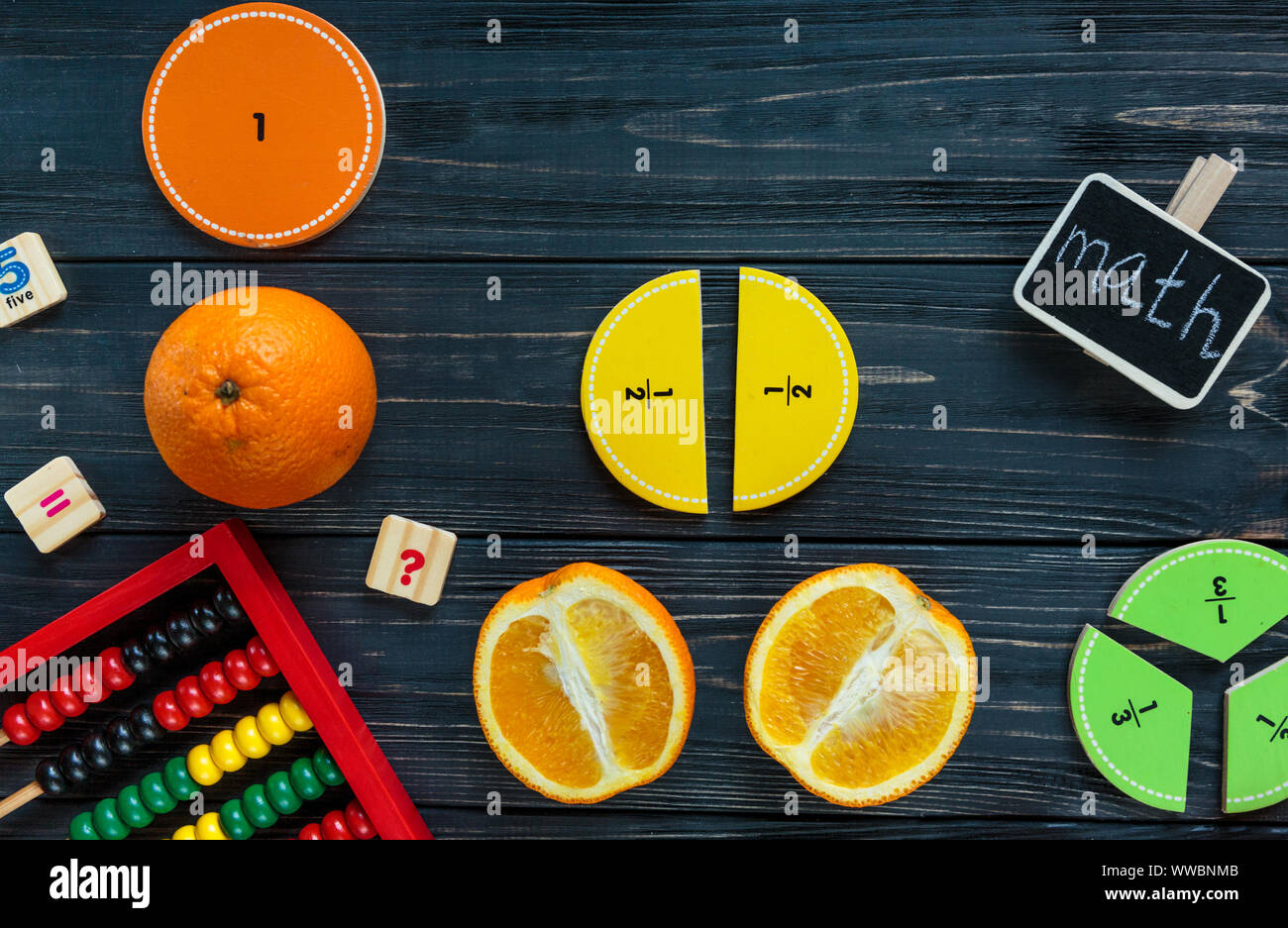 Colorful math fractions on wooden background or table. interesting math ...