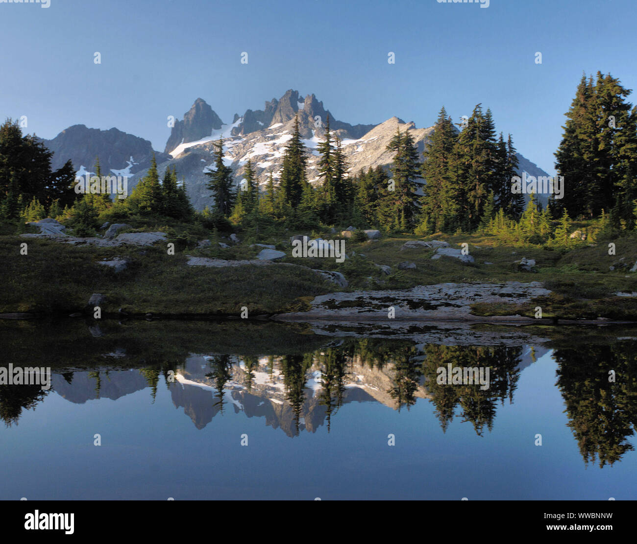 Morning light and alpine reflection Stock Photo - Alamy