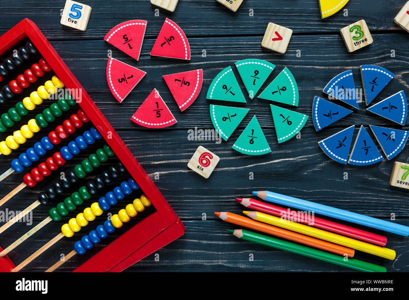 Colorful math fractions on wooden background or table. interesting math ...