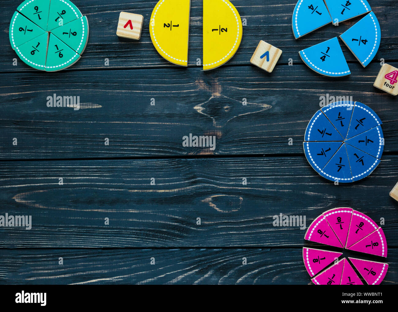 Colorful math fractions on wooden background or table. interesting math ...