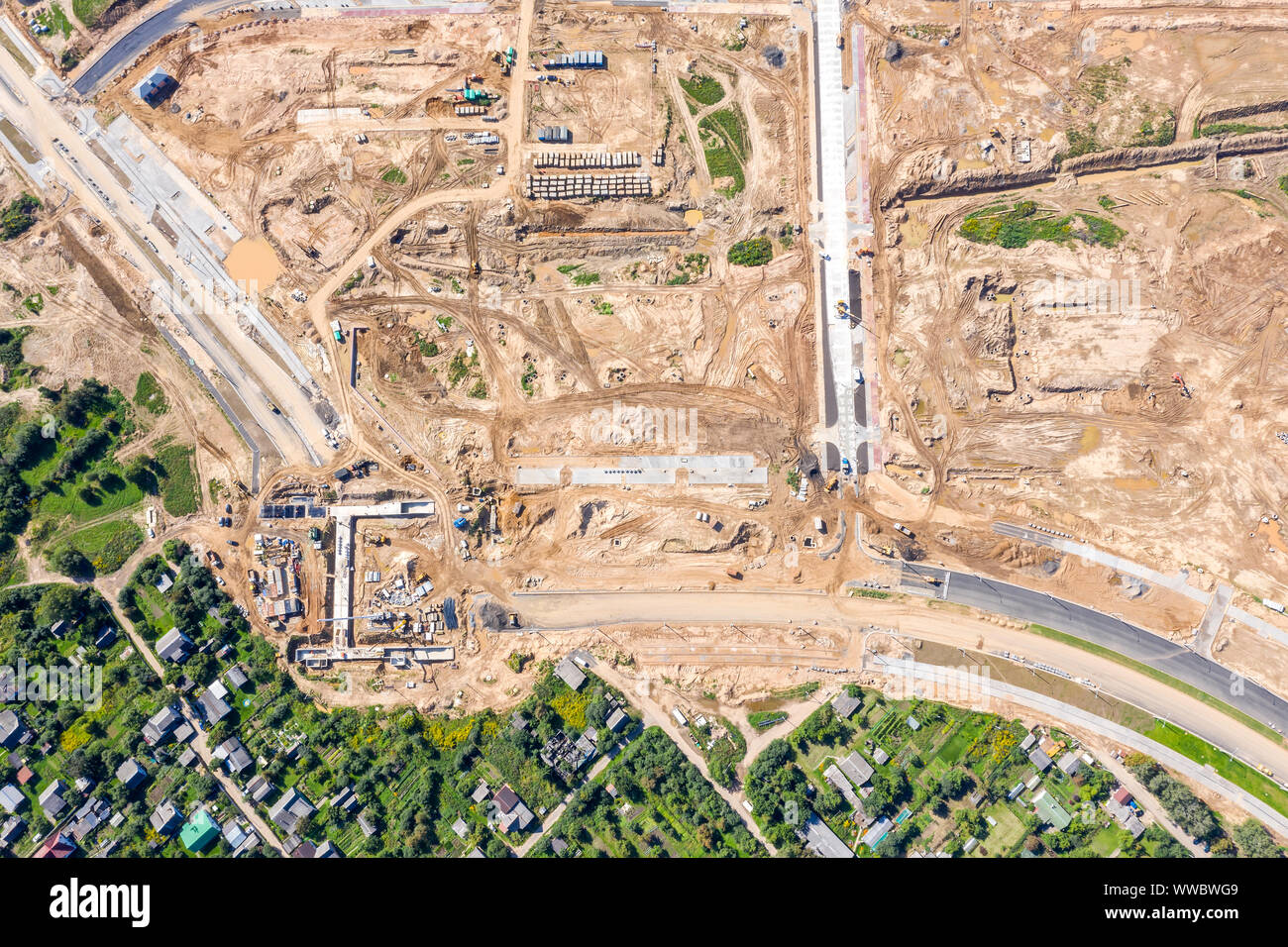 aerial top view of road construction site at suburb residential area ...