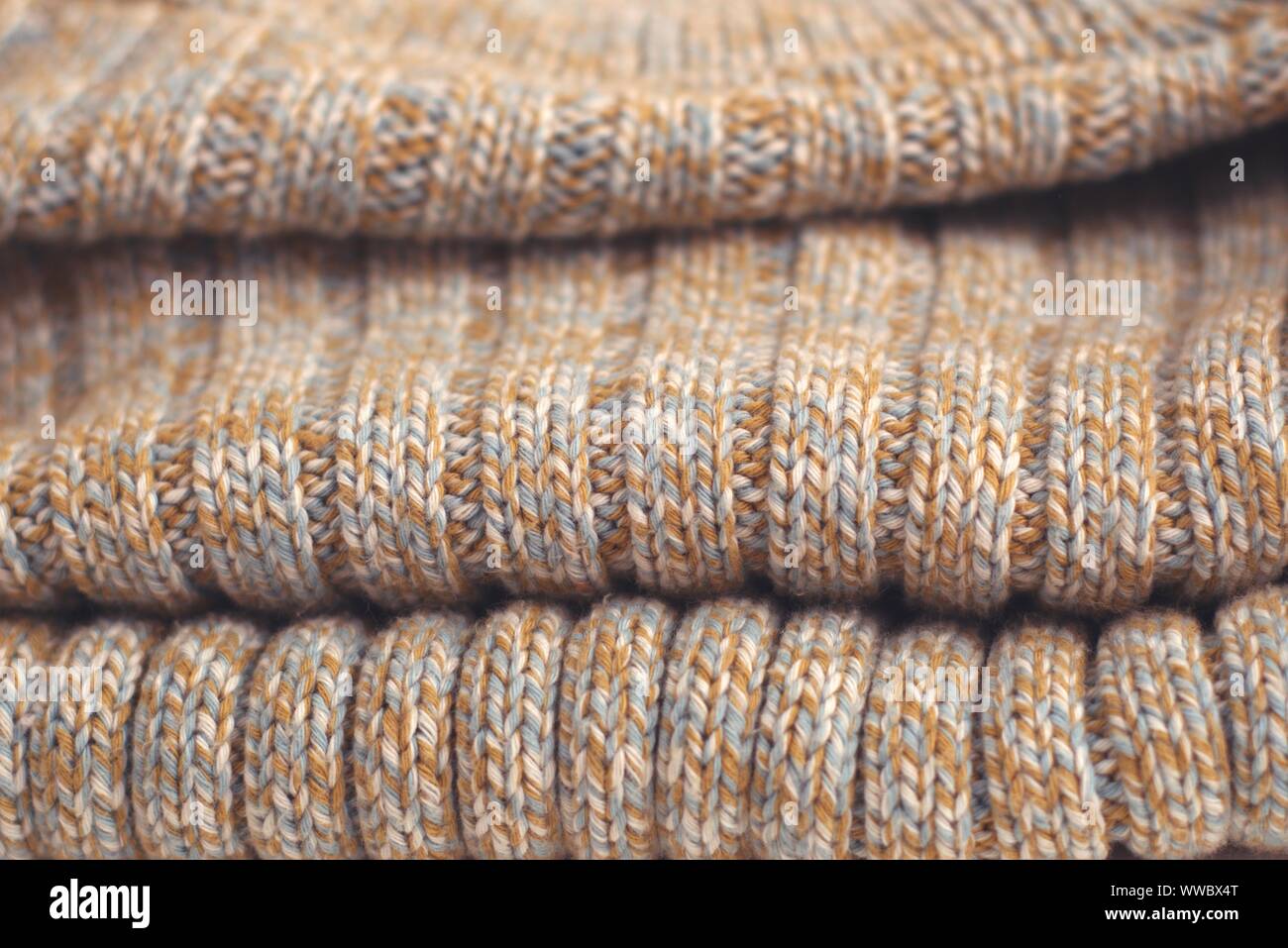 Mottled beige knitted woollen sweater. Texture detail close up Stock ...