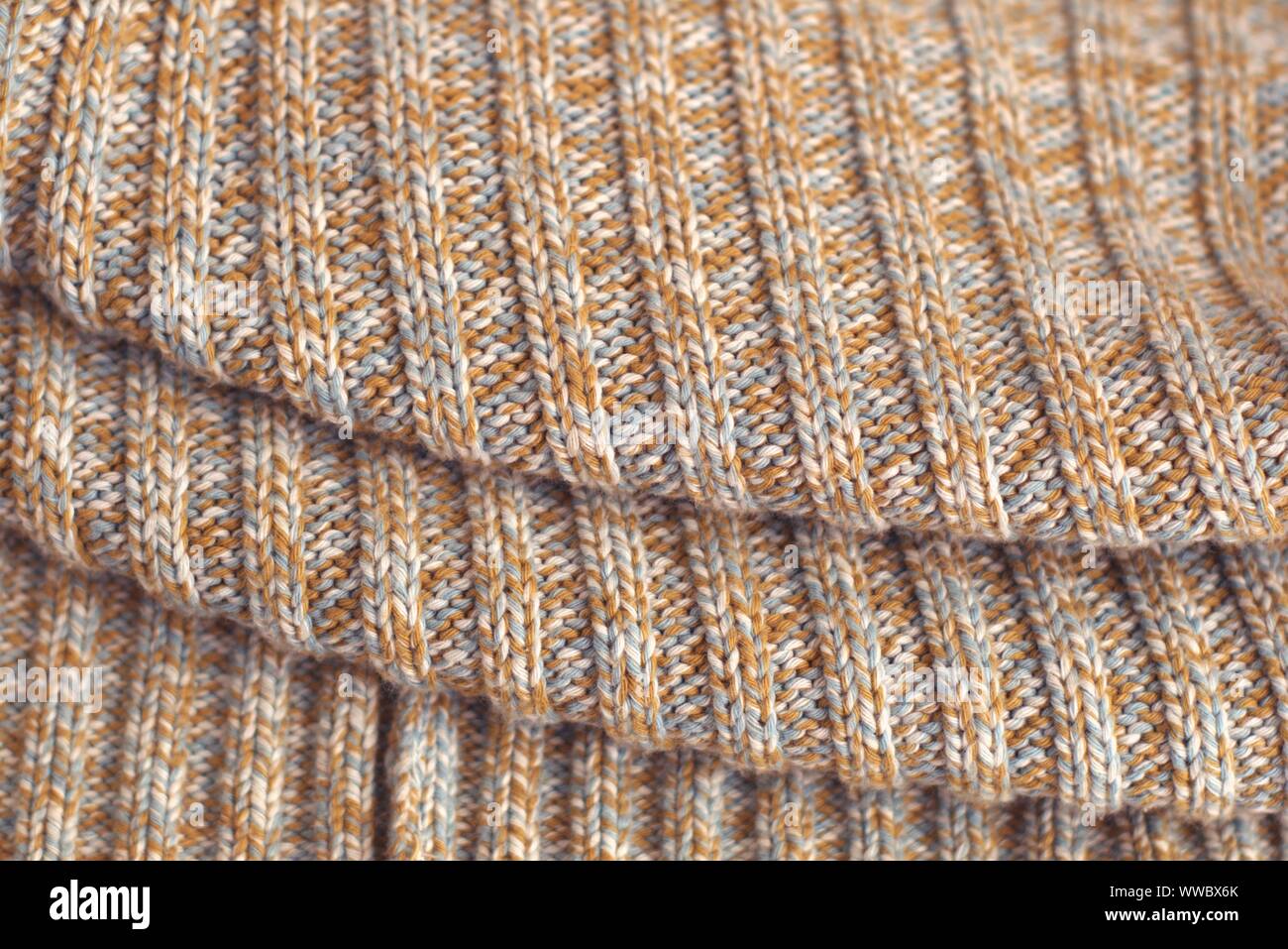 Mottled beige knitted woollen sweater. Texture detail close up Stock ...