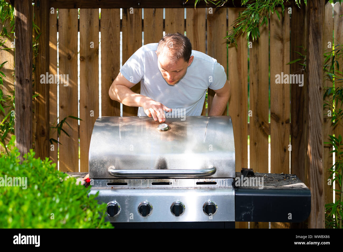 Barbeque modern new grill in outdoor nature summer backyard garden ...