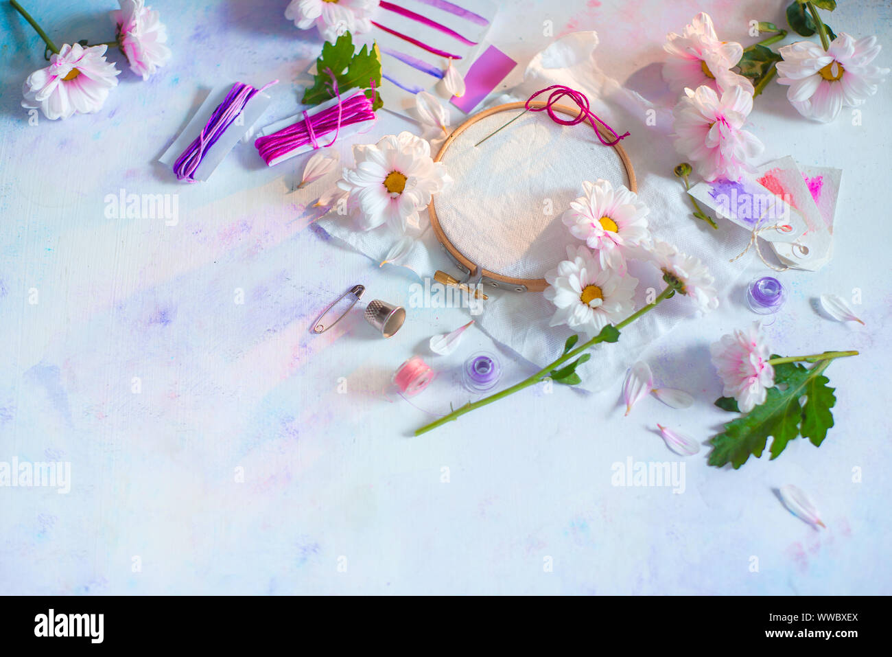 Embroidery frame header with flowers. Pink, white and purple pastel ...