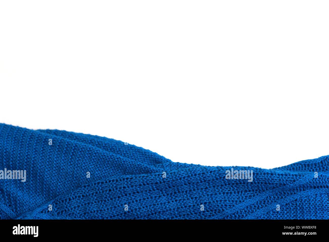 Azure blue crochet sweater on white background. Texture detail close up ...