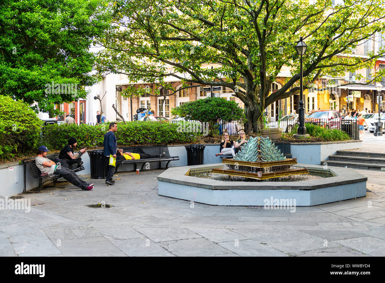 New Orleans, USA - April 22, 2018: People sitting on benches at LaTrobe ...