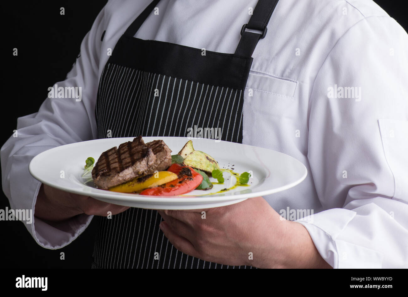 Man serves plate hi-res stock photography and images - Alamy
