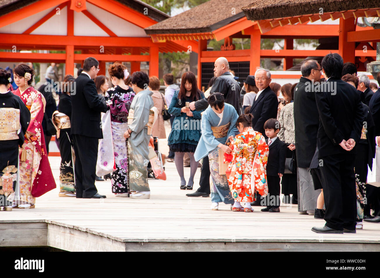 Japanese wedding guests on Miyajima Island in Japan Stock Photo - Alamy