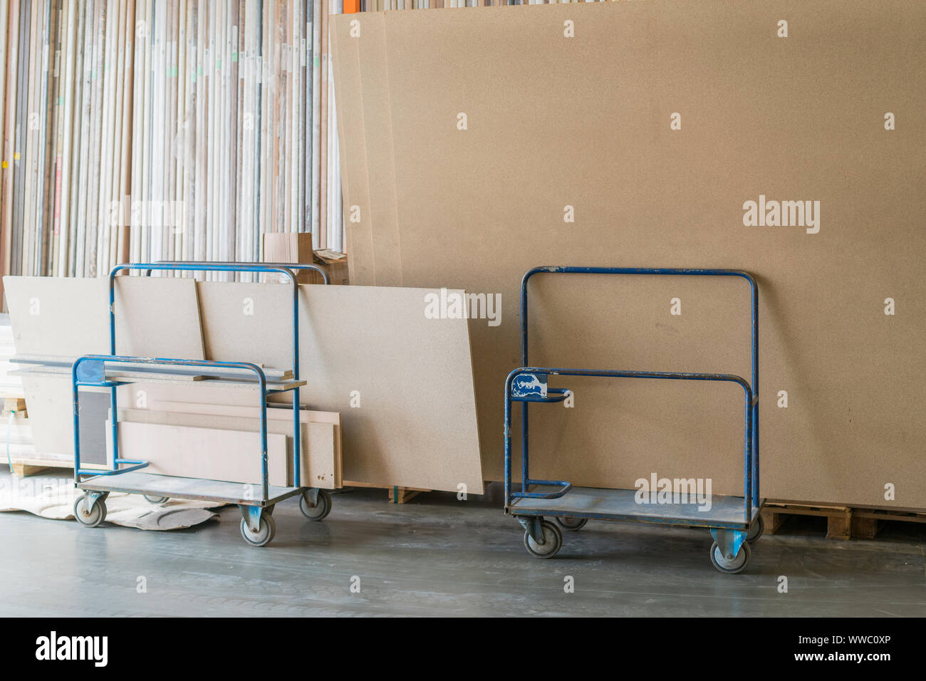 Trolley in a hardware store with building materials. Warehouse large ...